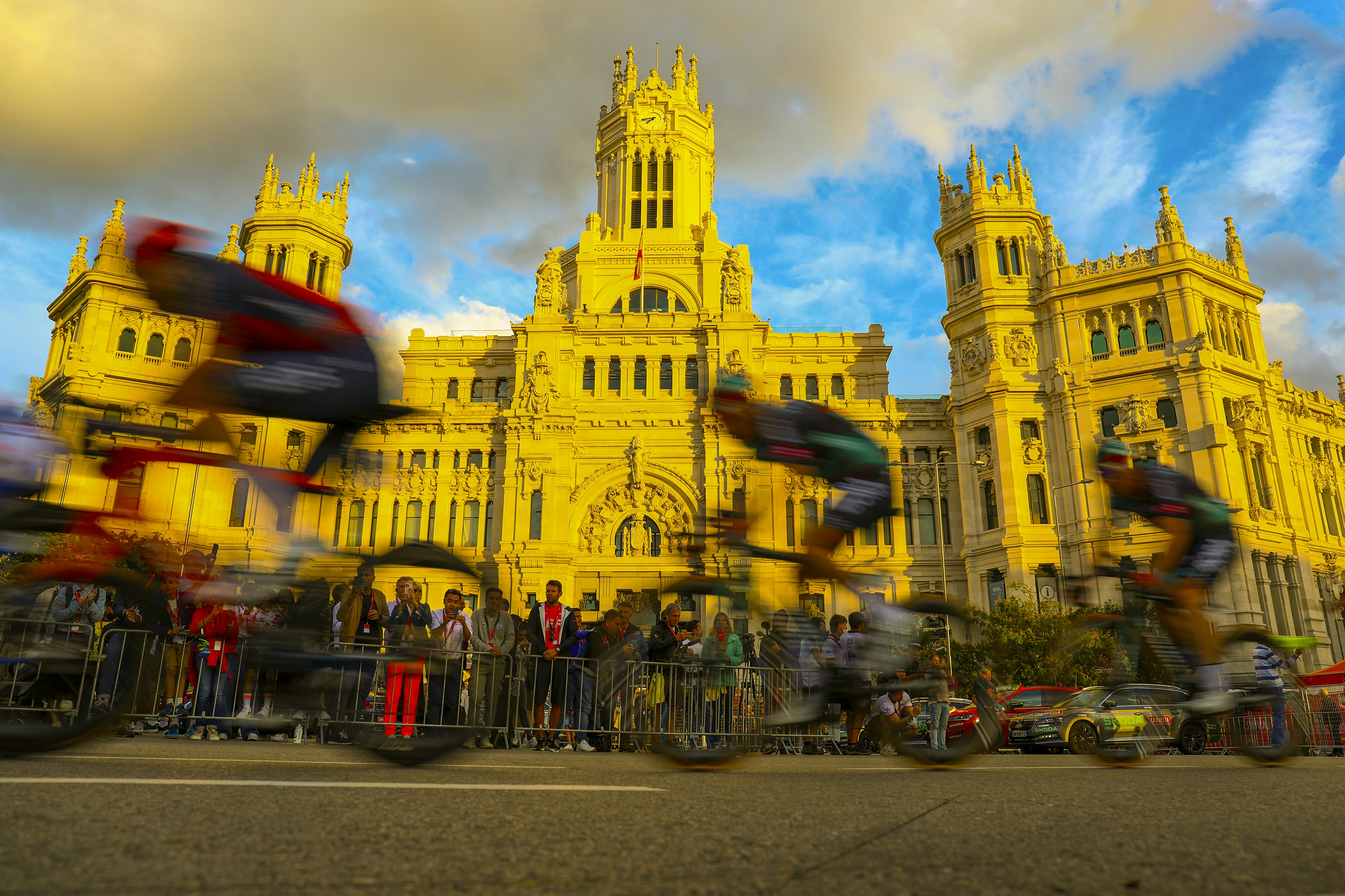 Cyclists in Motion Past Cibeles Palace