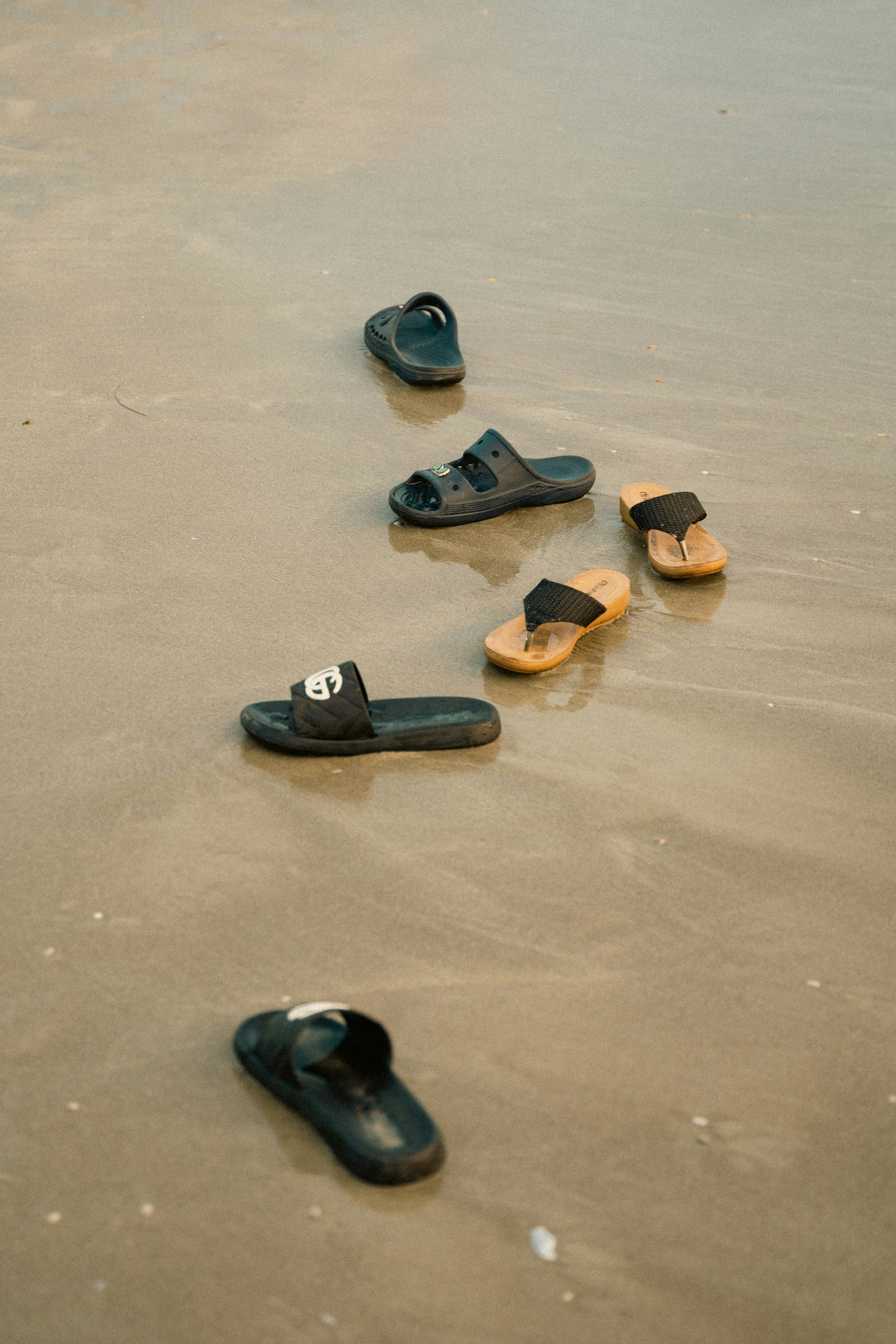 Tide-Tossed Footwear: A Minimal Beach Still-Life