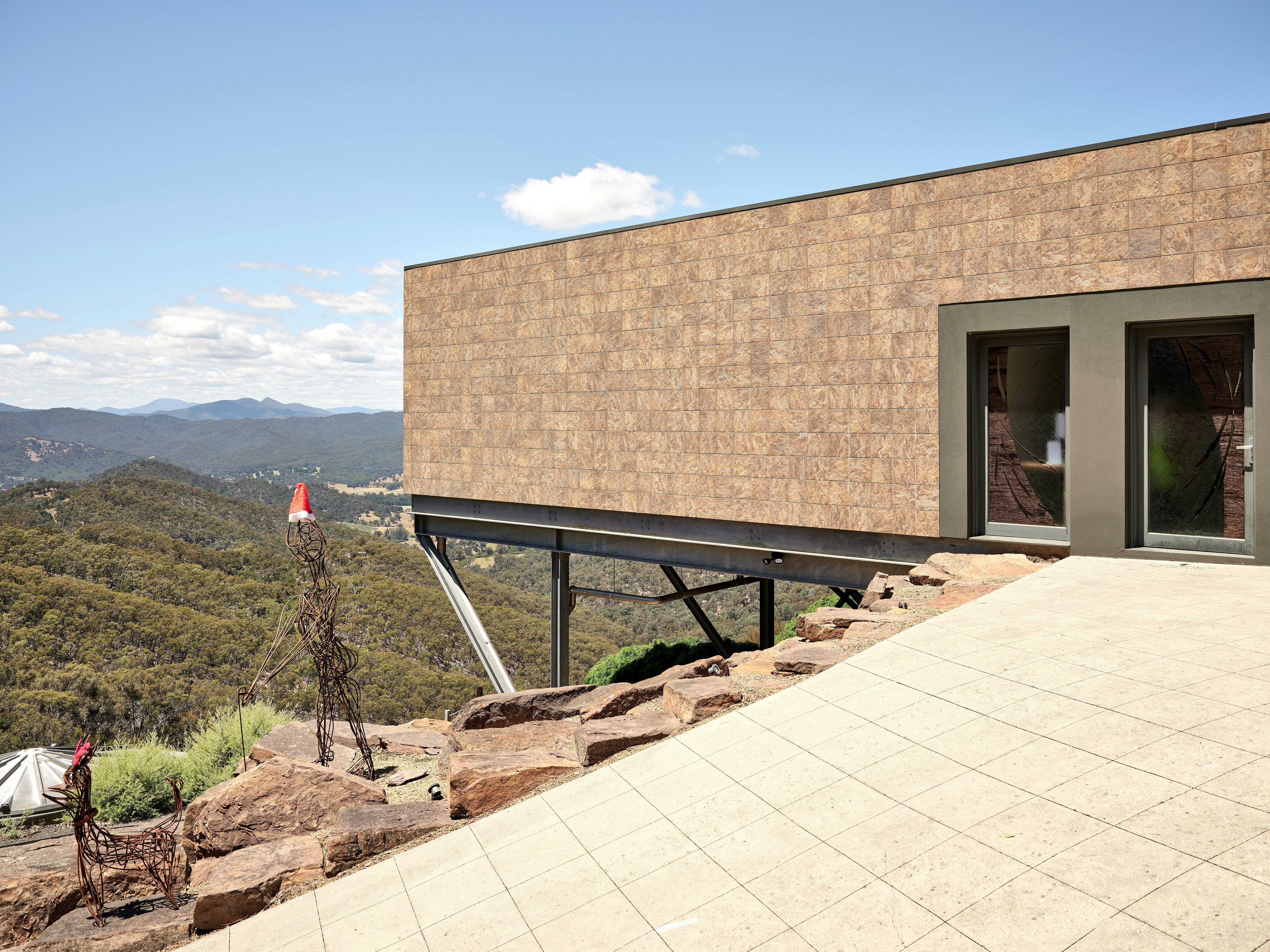 A view of a building with a view of the mountains photo – Free ...