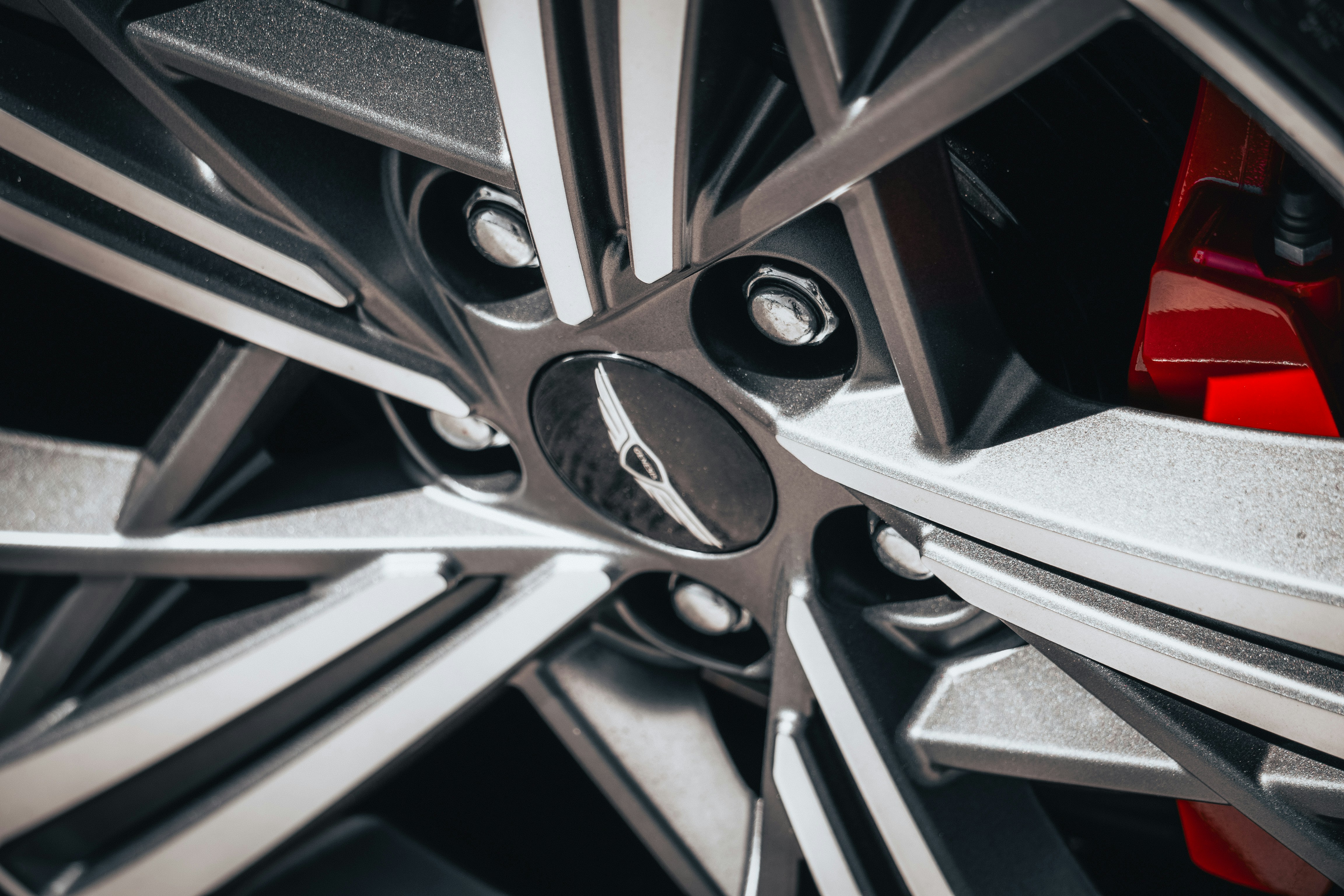 Apex of Alloy: Centered Rim Emblem with Vented Red Caliper Echo