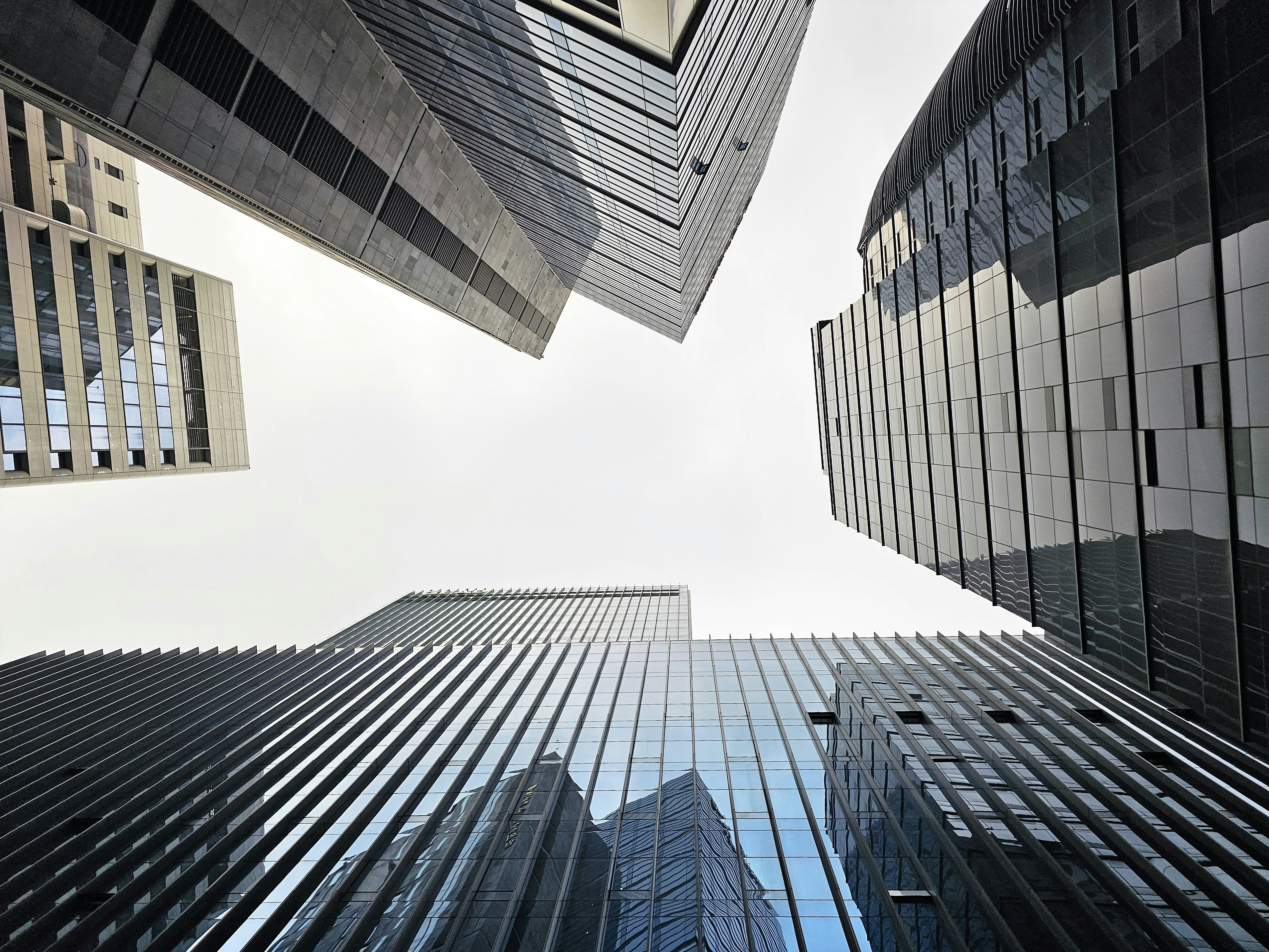 Looking up at tall buildings in a city photo – Free Building Image on ...