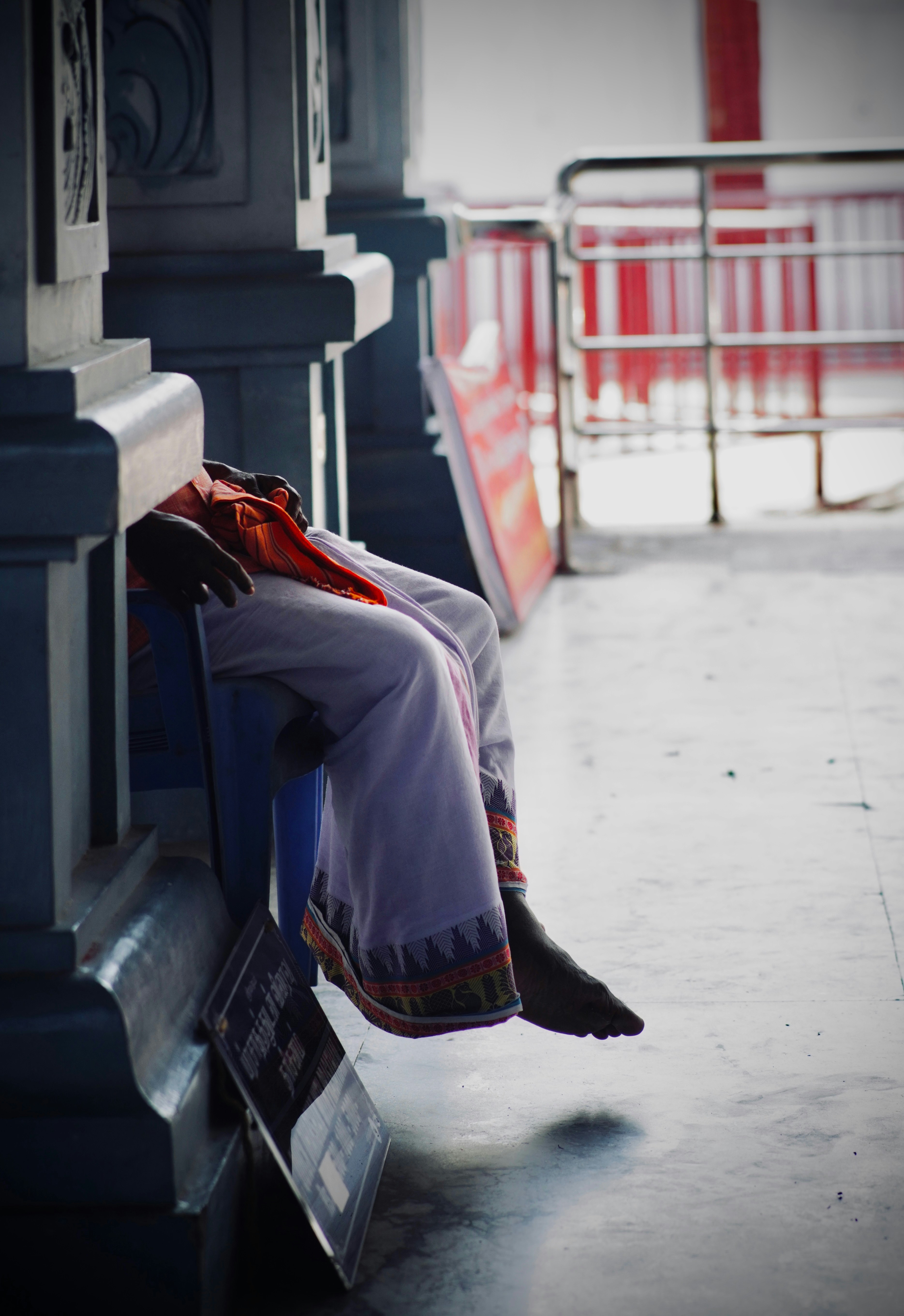 A person sitting on a bench in a building photo – Free Sleep,relax ...
