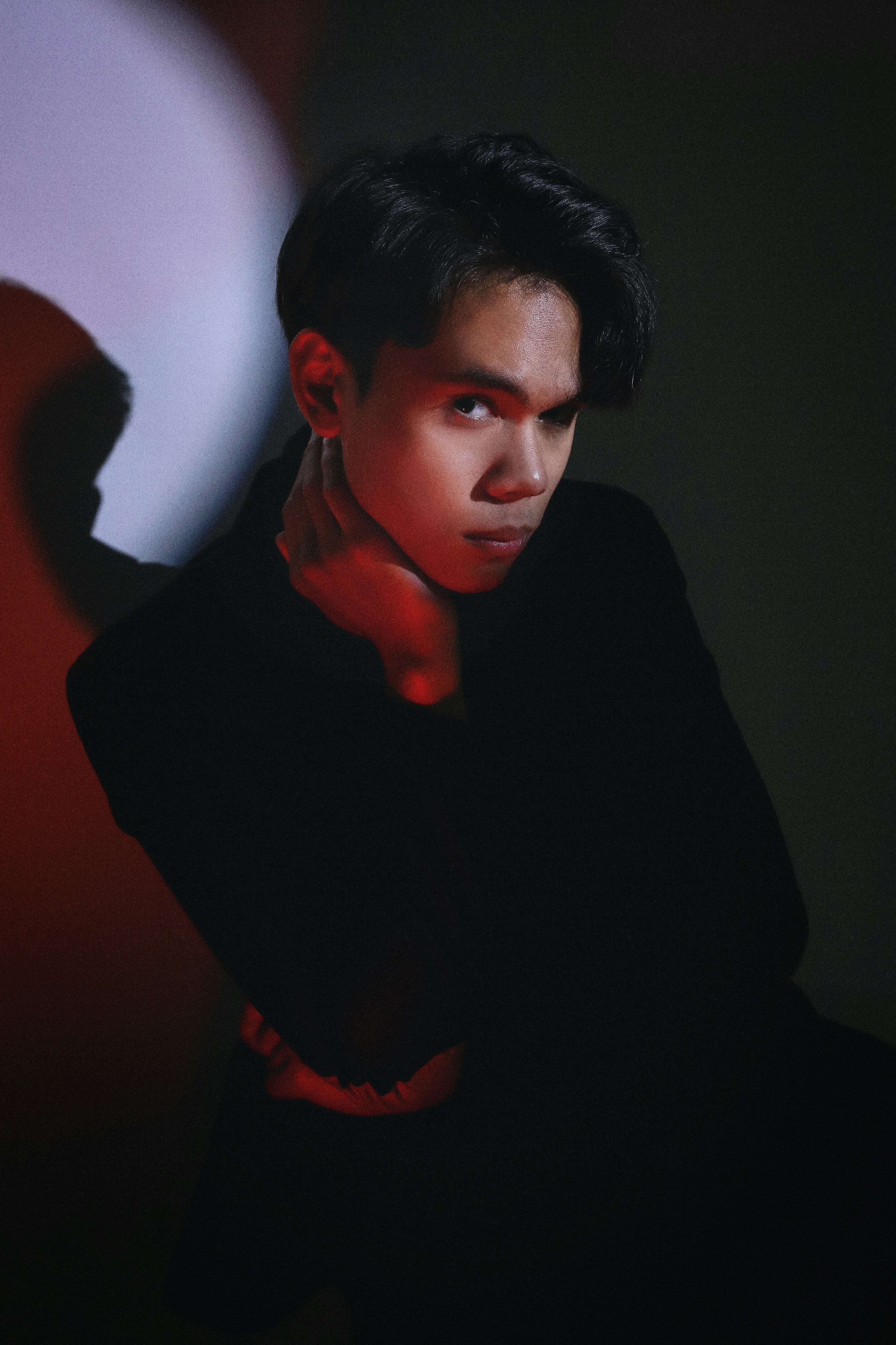Midnight Introspection: A Portrait Wrapped in Shadow and Warm Light