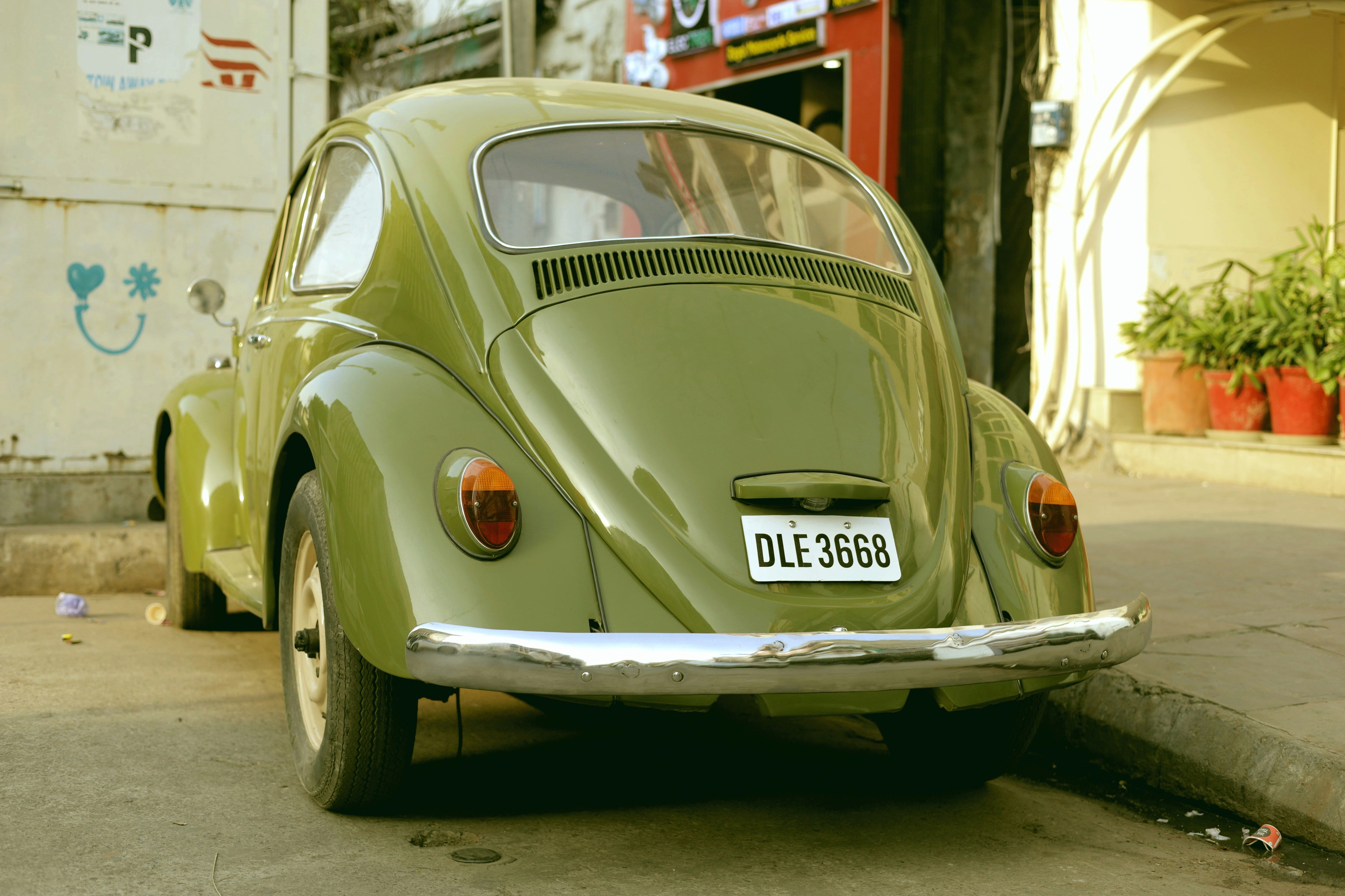A green car parked on the side of the road