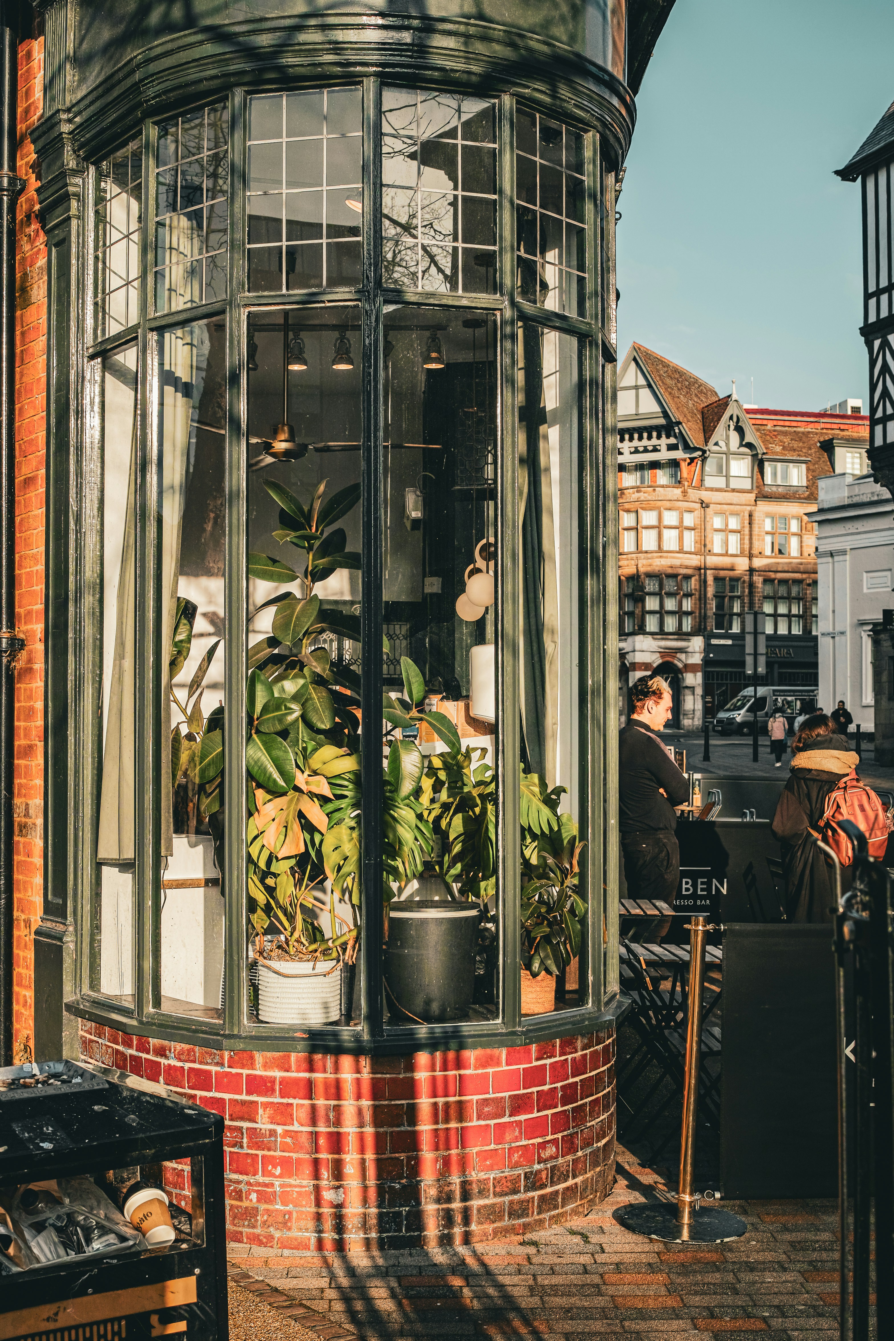 A group of people standing outside of a building photo – Free Bay ...