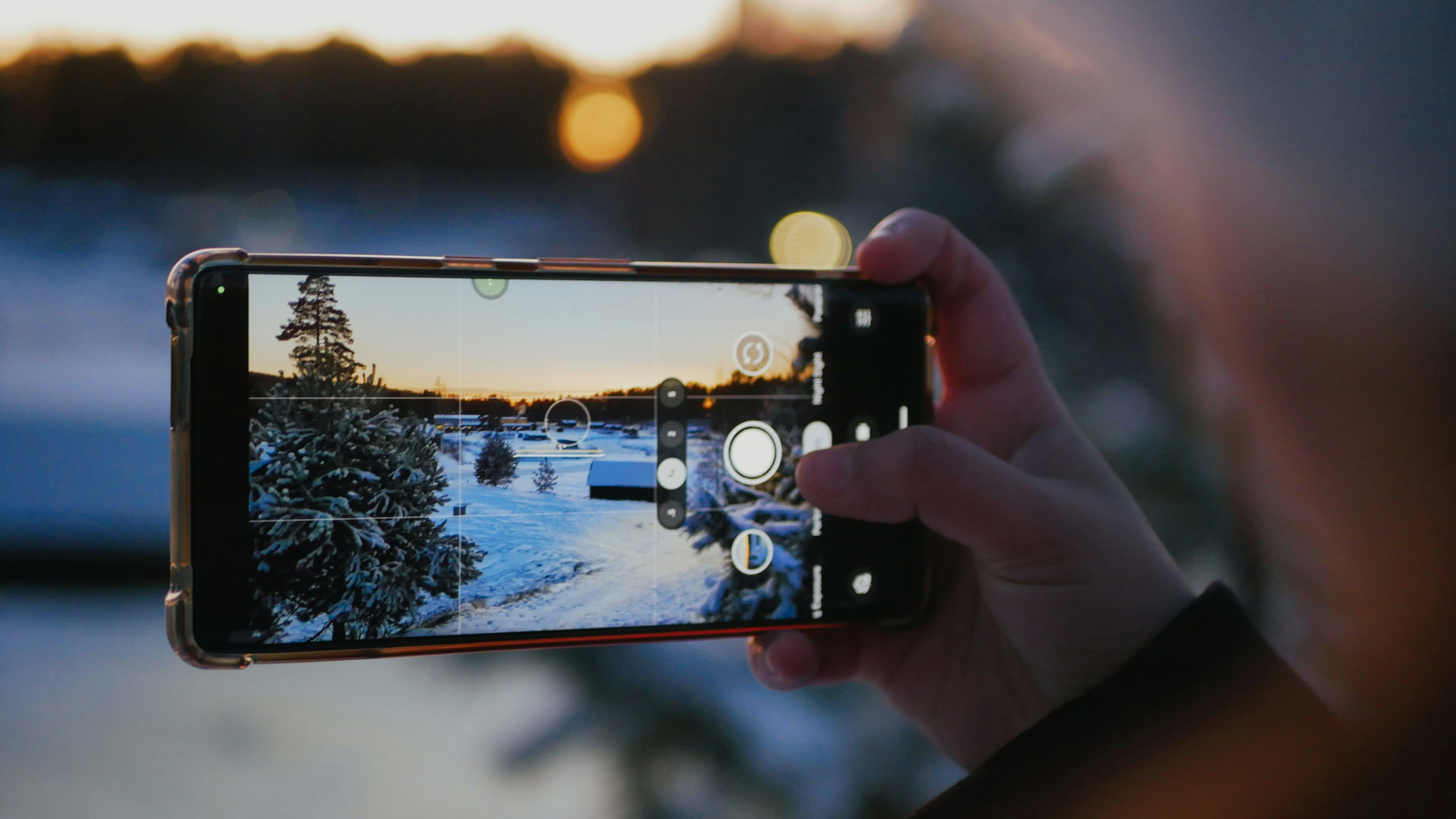 A person taking a picture with a camera phone photo – Free Photo Image ...