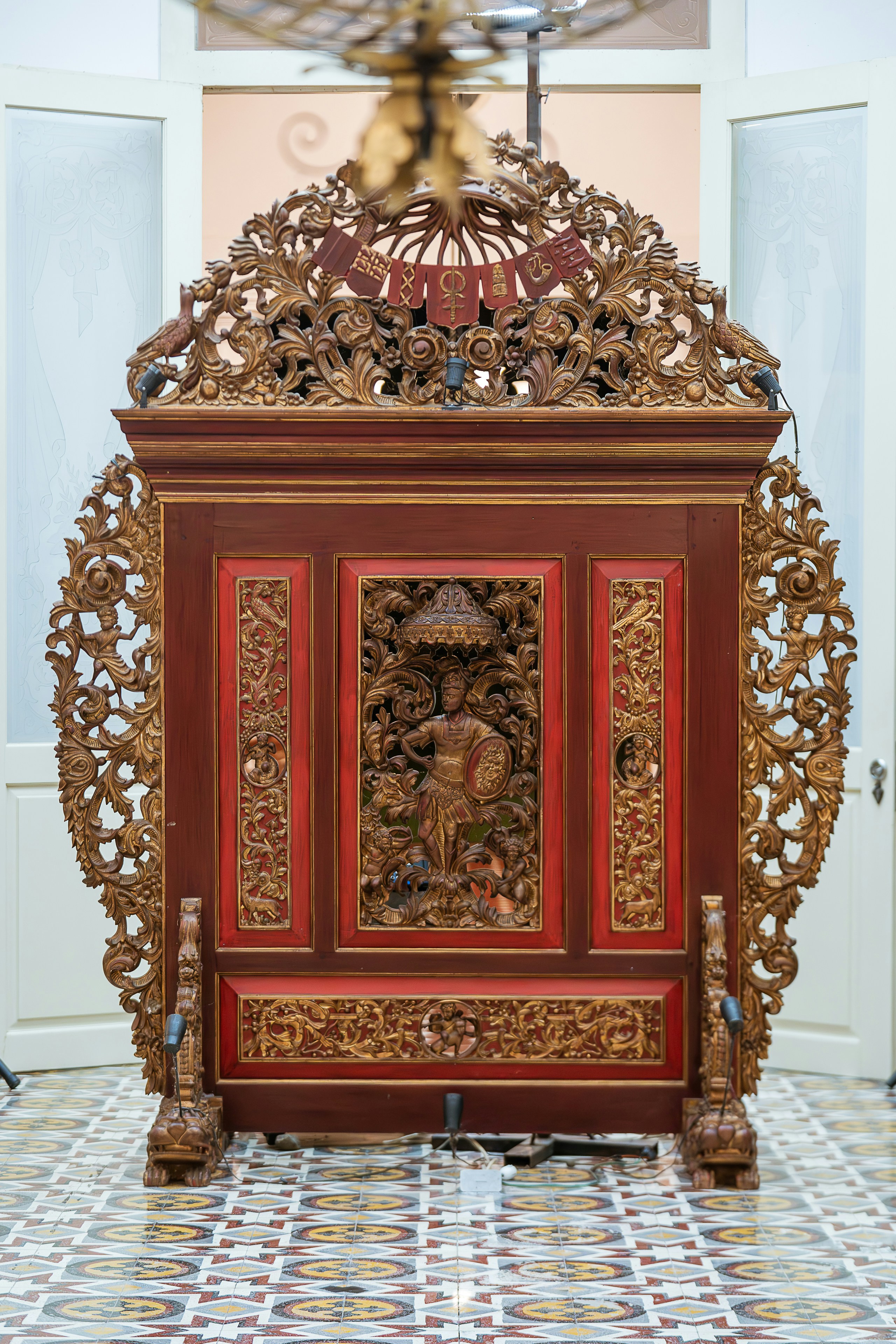 Central Shrine: A Red-Wood Cabinet Framed in Gilded Filigree