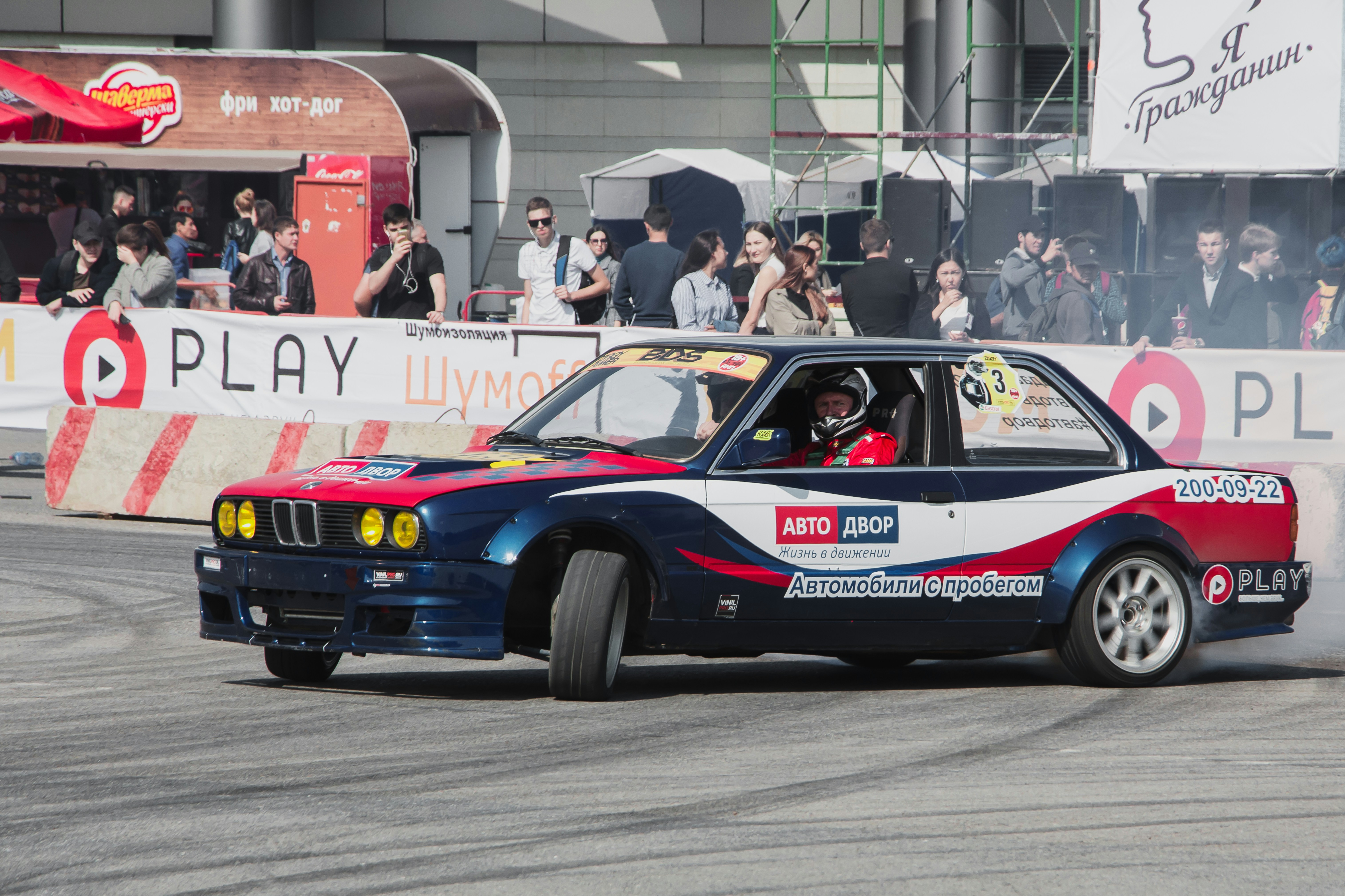 A car driving around a track with smoke coming out of it photo – Free Car Image on Unsplash
