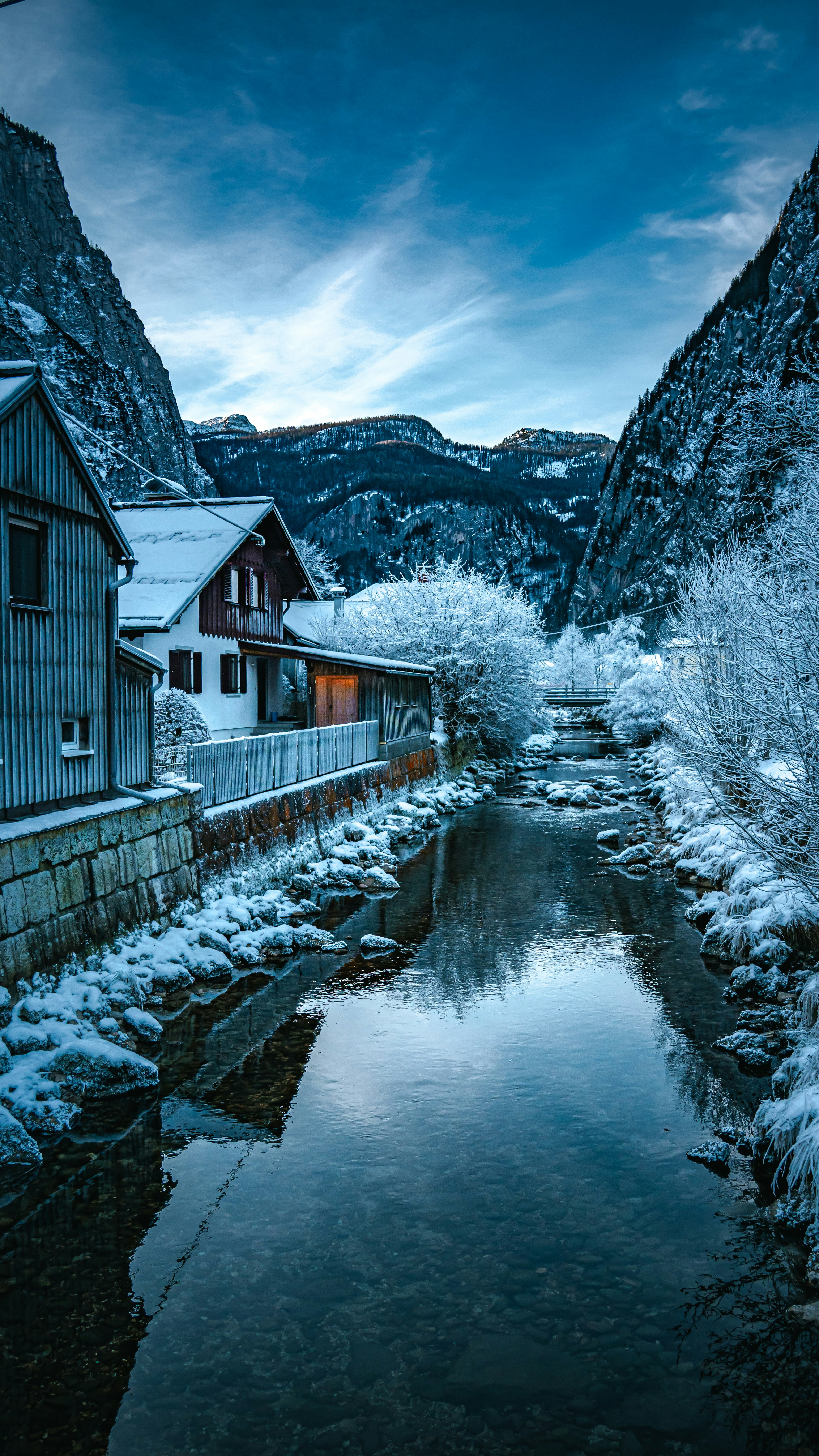 A river running through a snow covered hillside photo – Free Hallstatt ...