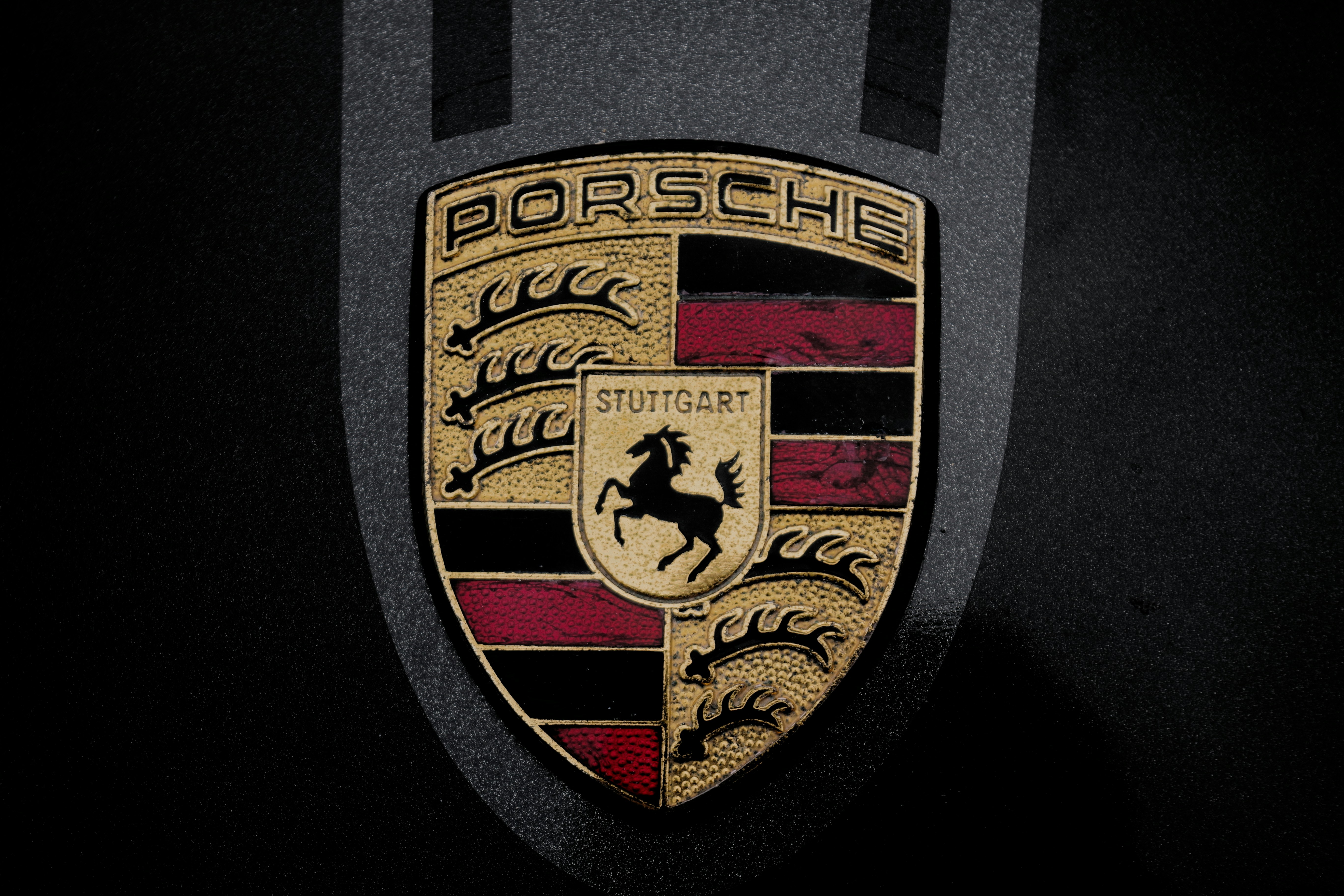 Emblem in the Night: Porsche Crest on Matte Black Canvas