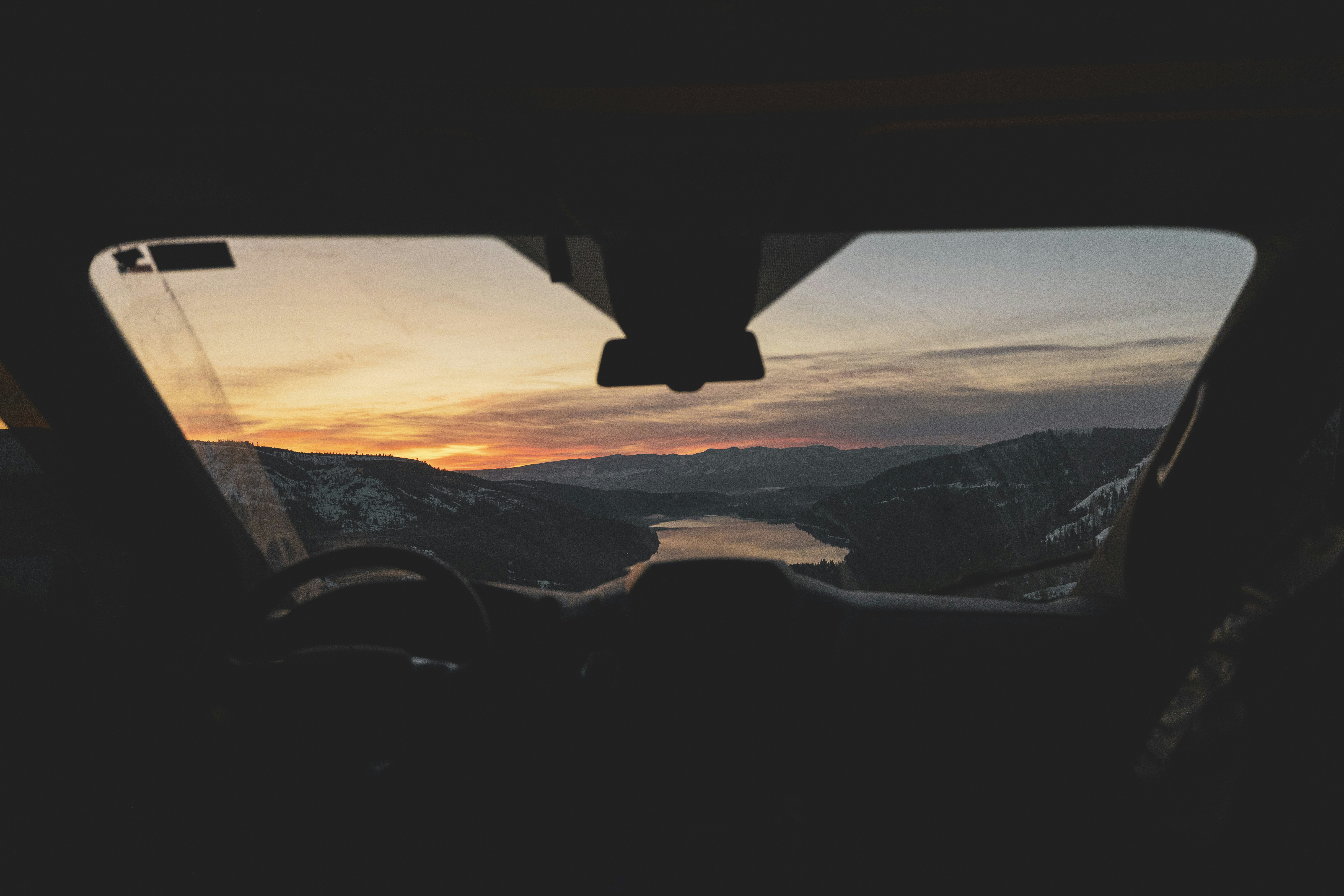 A view of a sunset from inside a vehicle photo – Free Fog Image on Unsplash