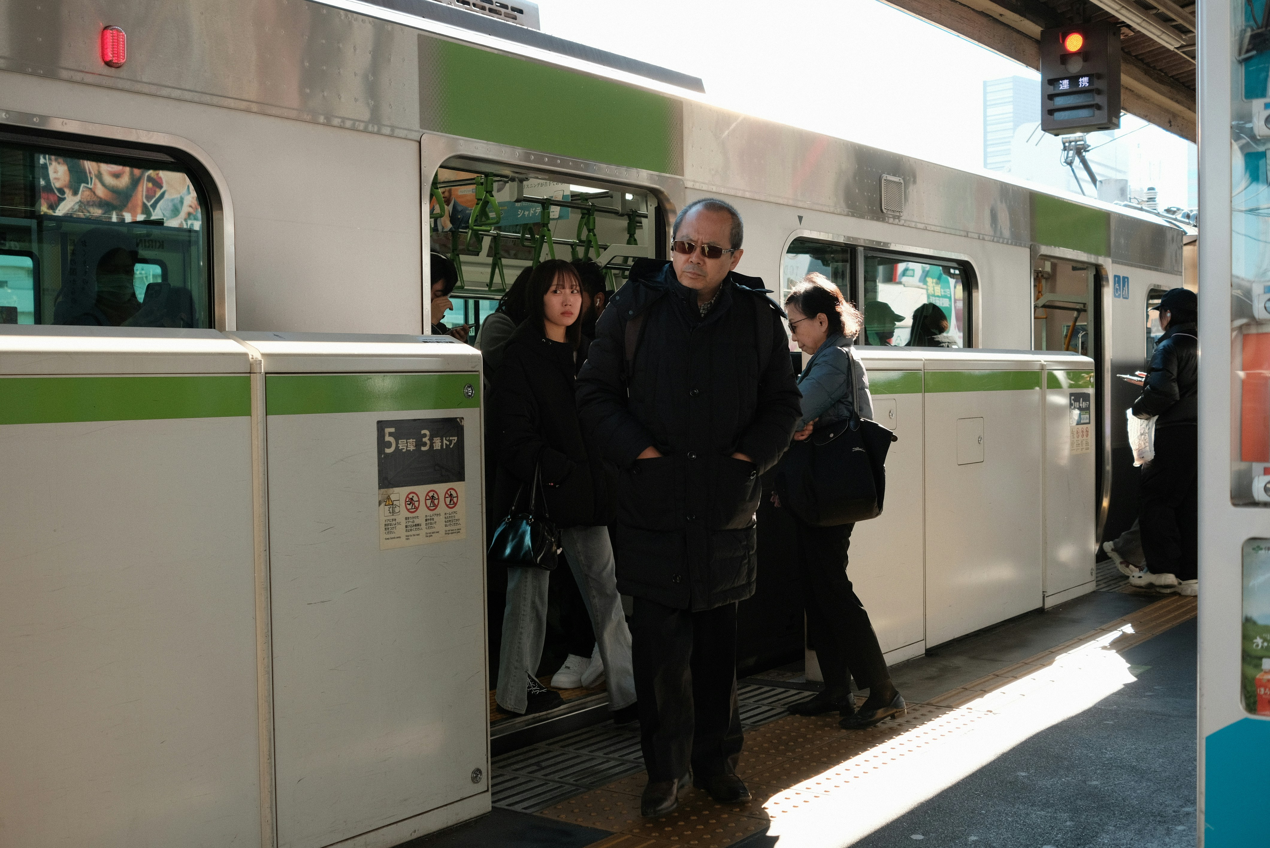 A group of people boarding a subway train photo – Free Ōkubo Image on ...
