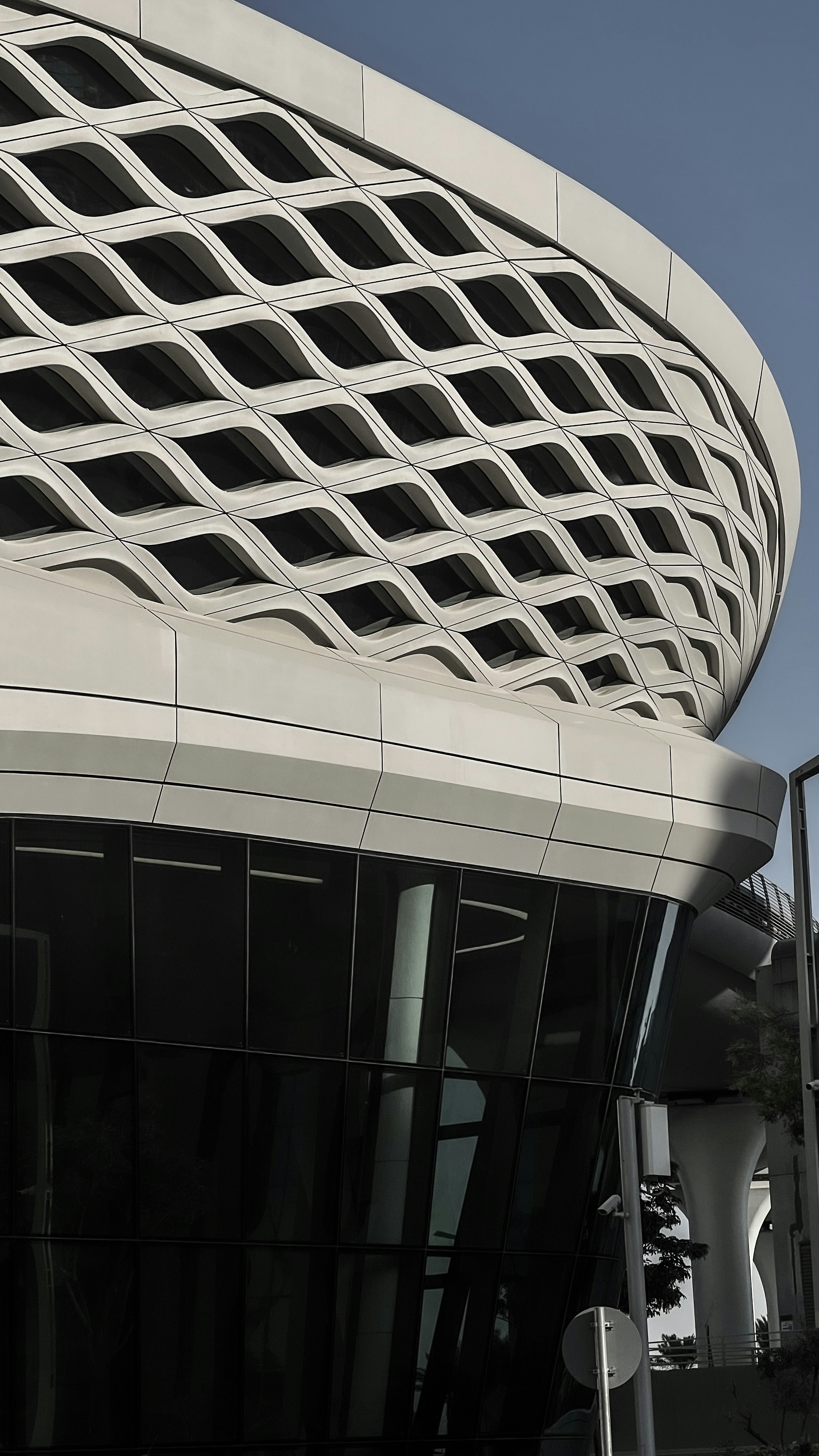 A large white building with a circular roof photo – Free Building Image ...