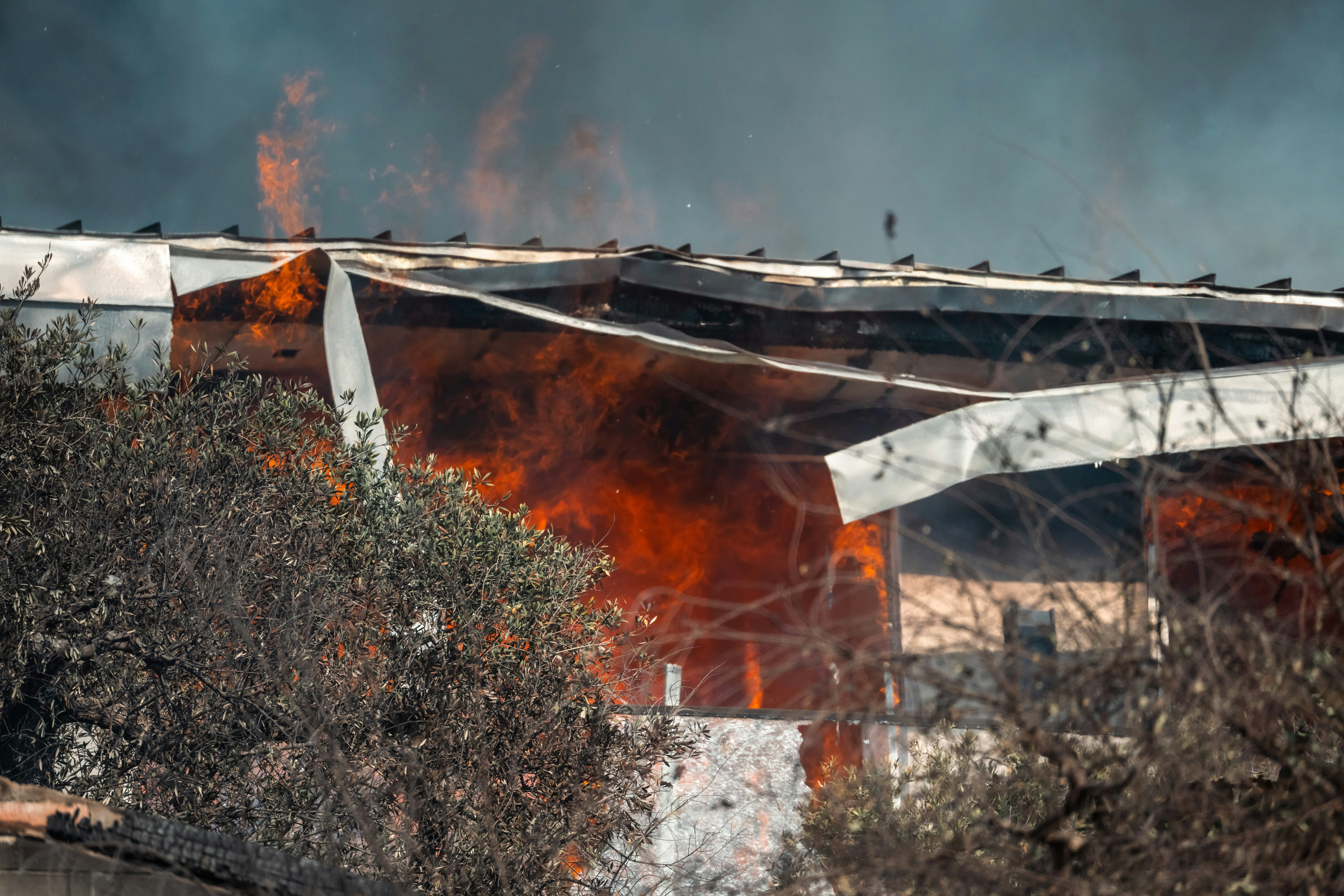A fire that is burning in a building photo – Free Fire Image on Unsplash