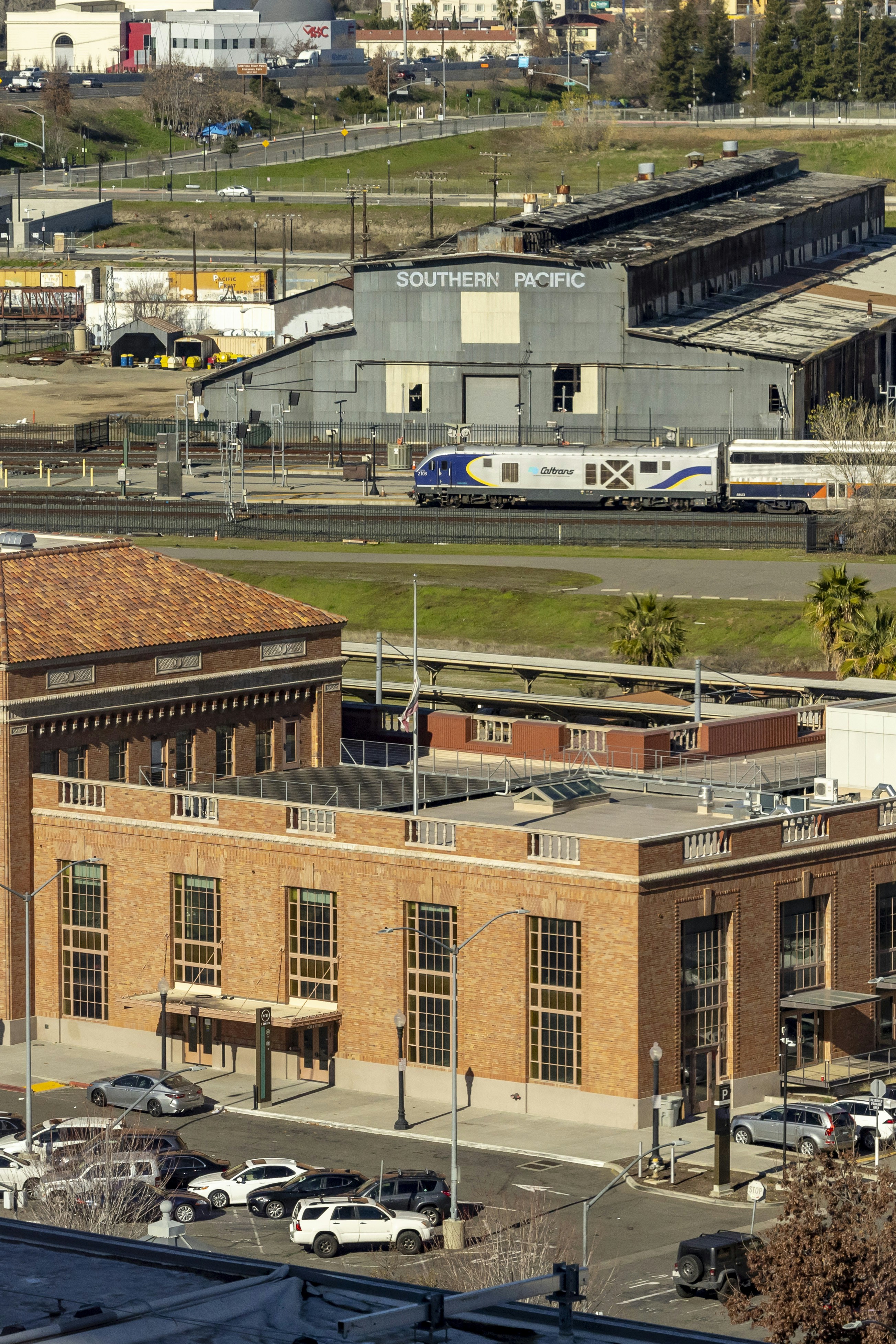 Industrial Railscape: Southern Pacific Yard Meets Urban Brick Facades