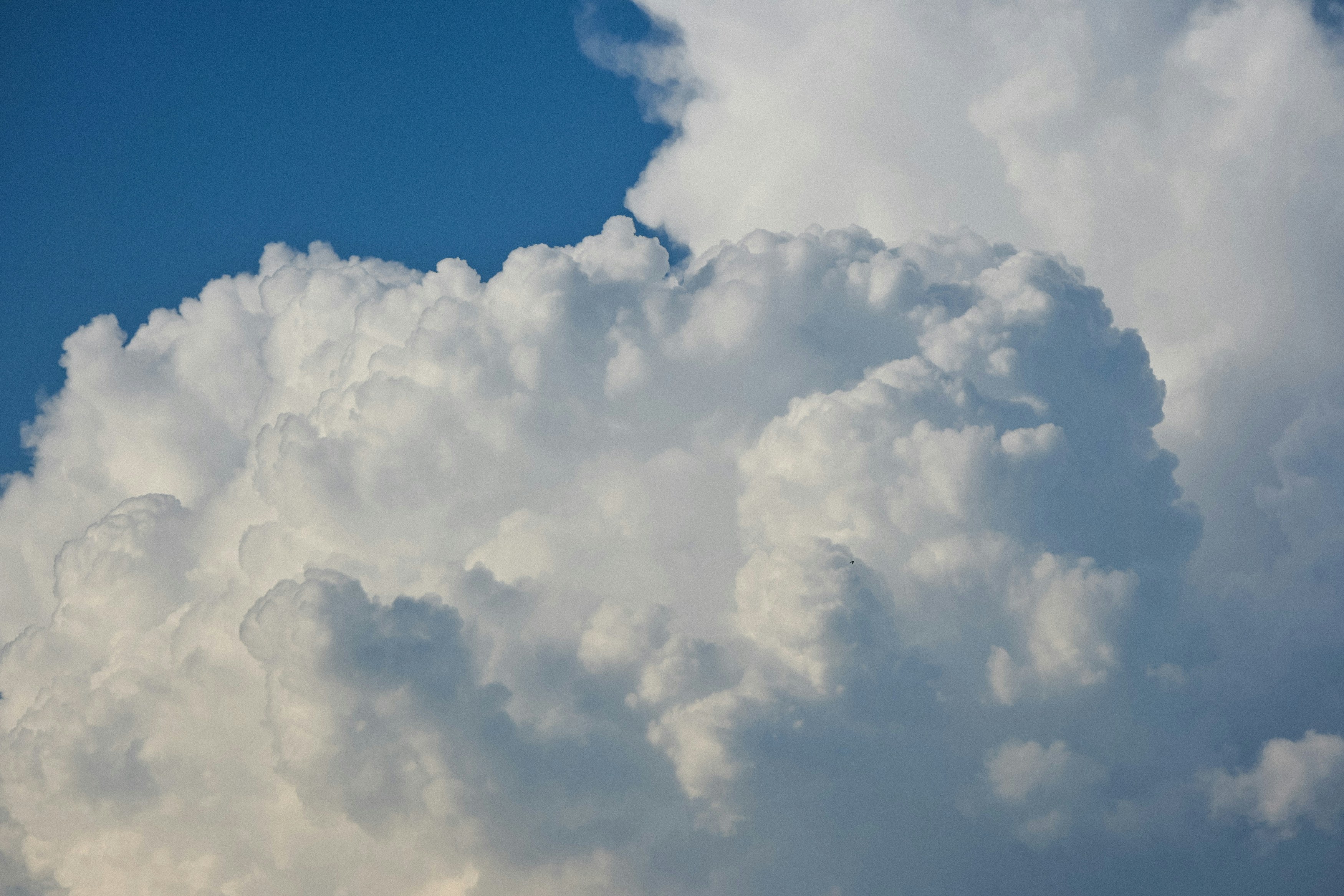 A plane flying through a cloud filled sky photo – Free Cloud Image on ...