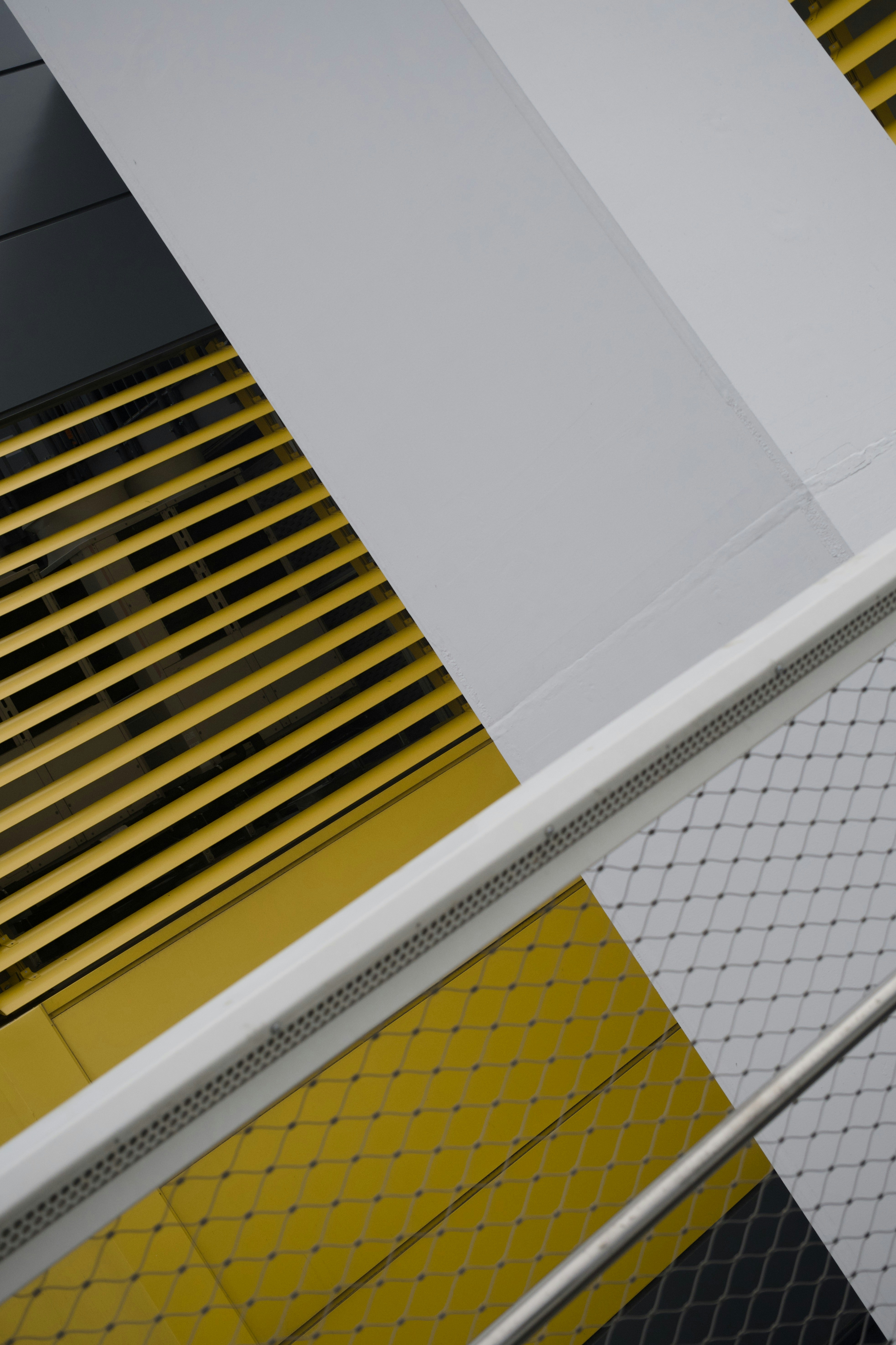 Angles, Grilles and Grey Planes: Abstract Facade in Diagonal Light