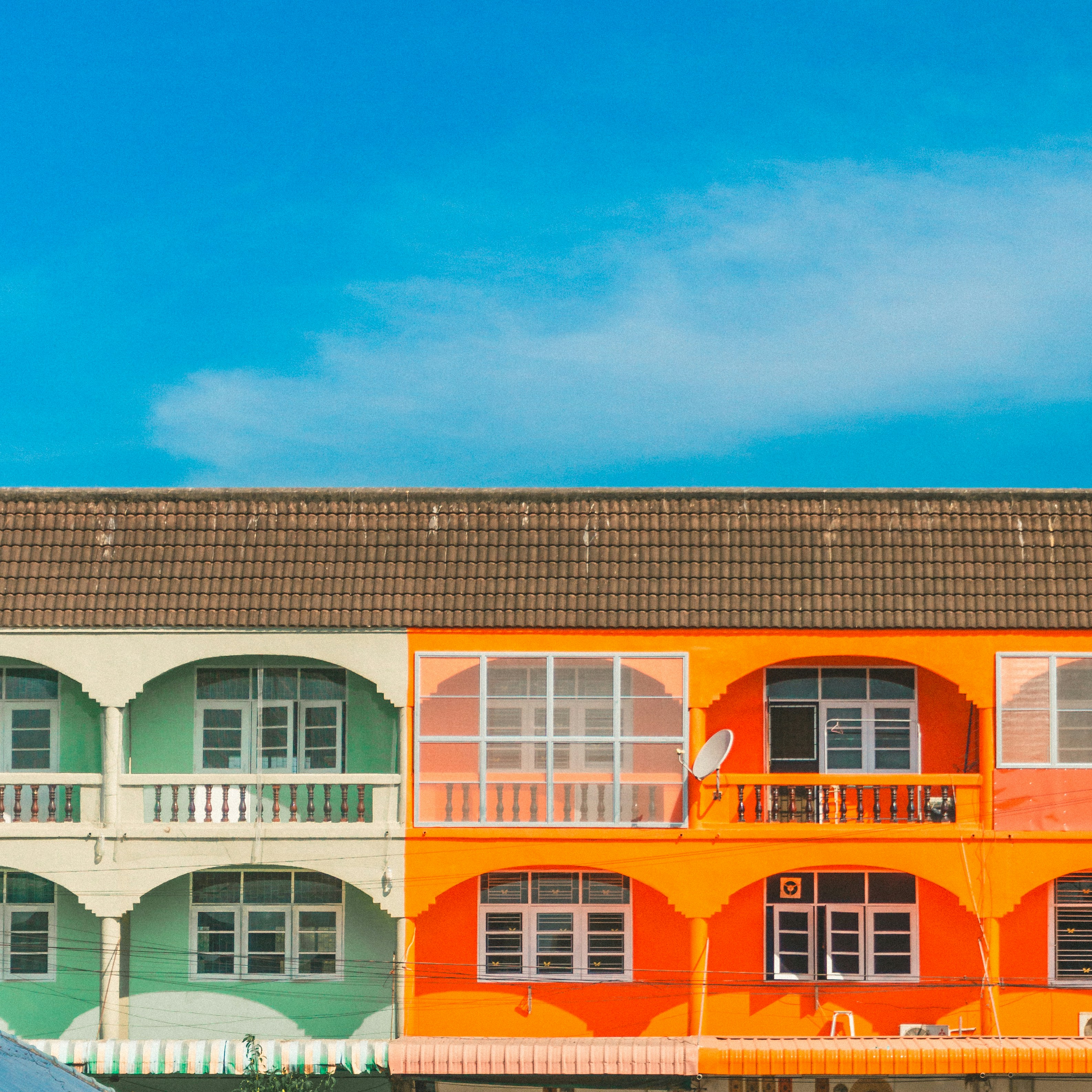 Orange-Winged Courtyard: A Facade of Color and Balance