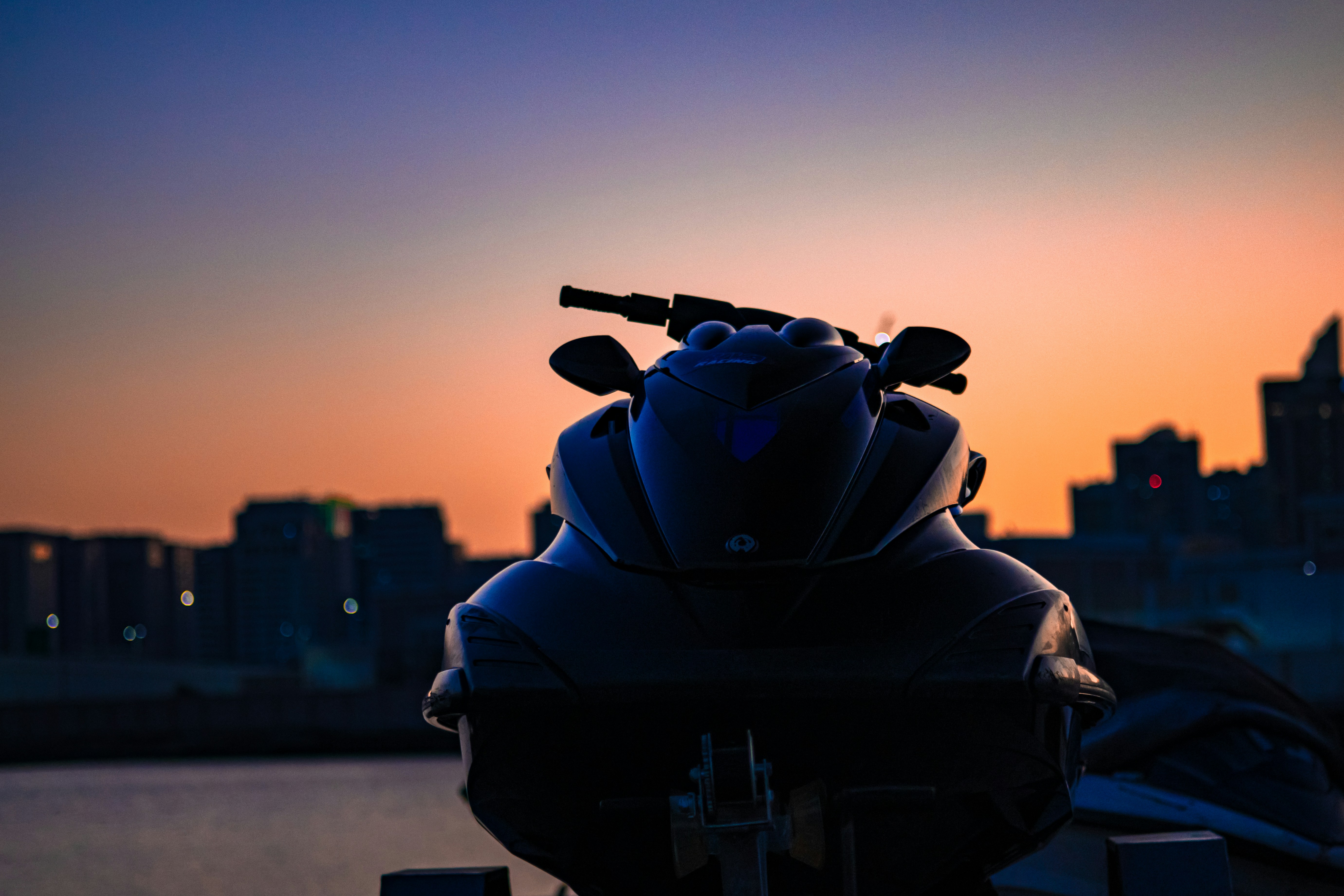 Silhouette of Adventure Against a Cityscape Sunset