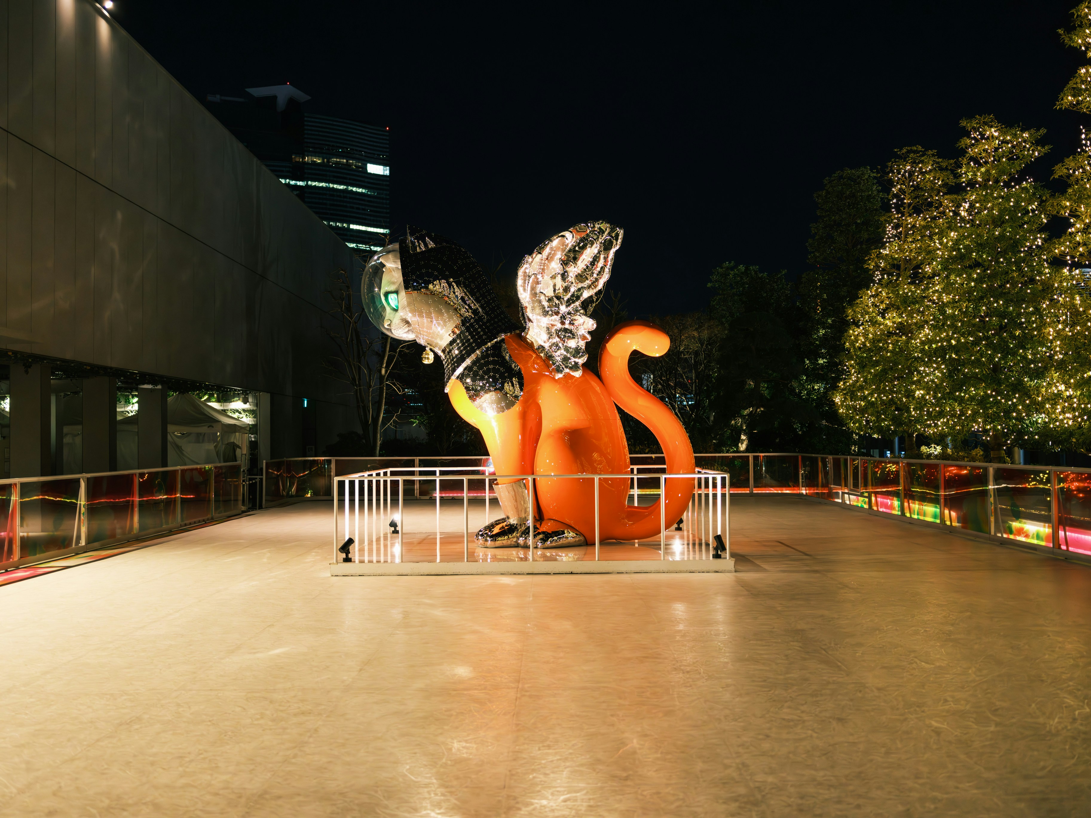 Neon-lit sculpture on a quiet urban night