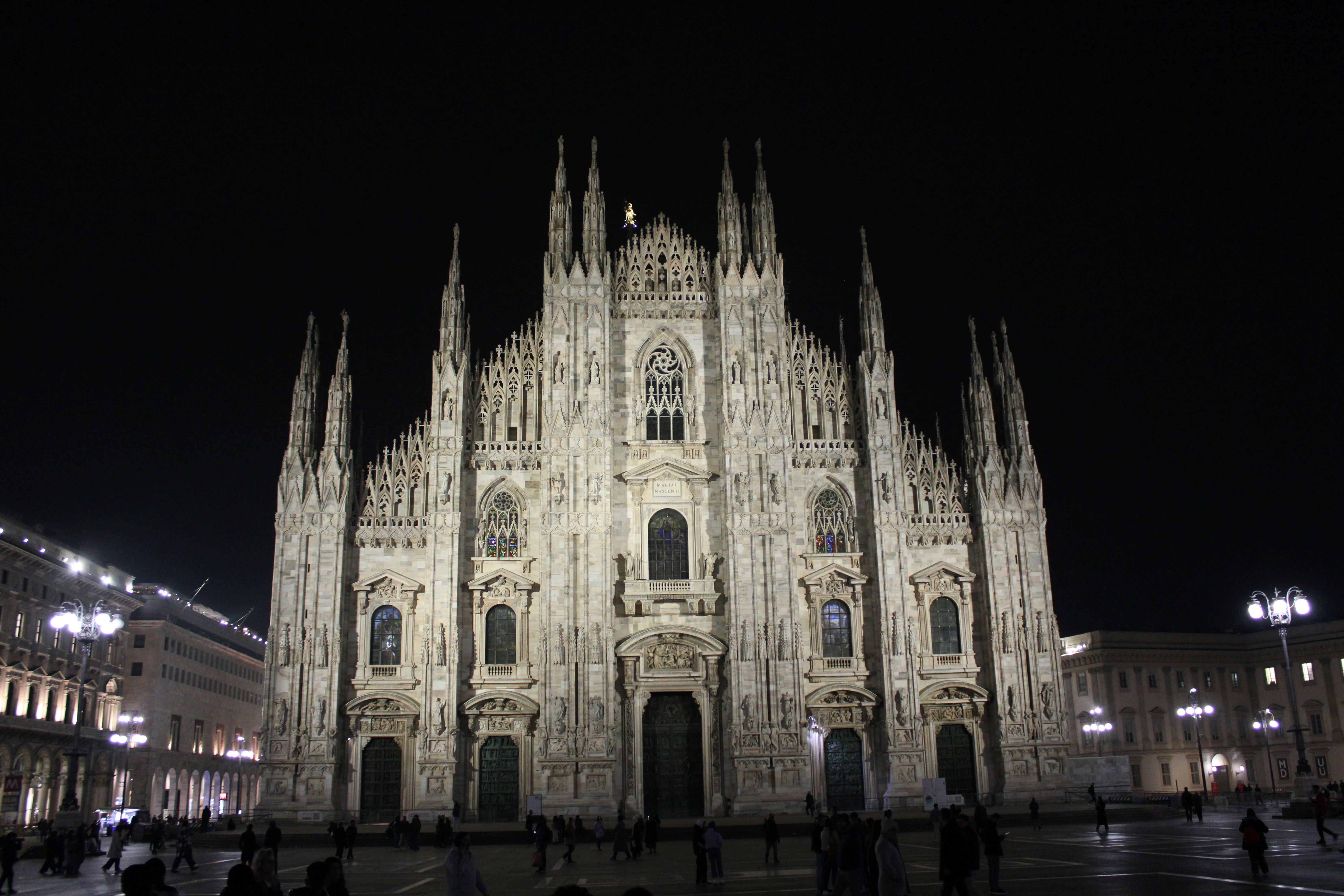 Nocturnal Facade: The Duomo di Milano Illuminated in Stone and Light