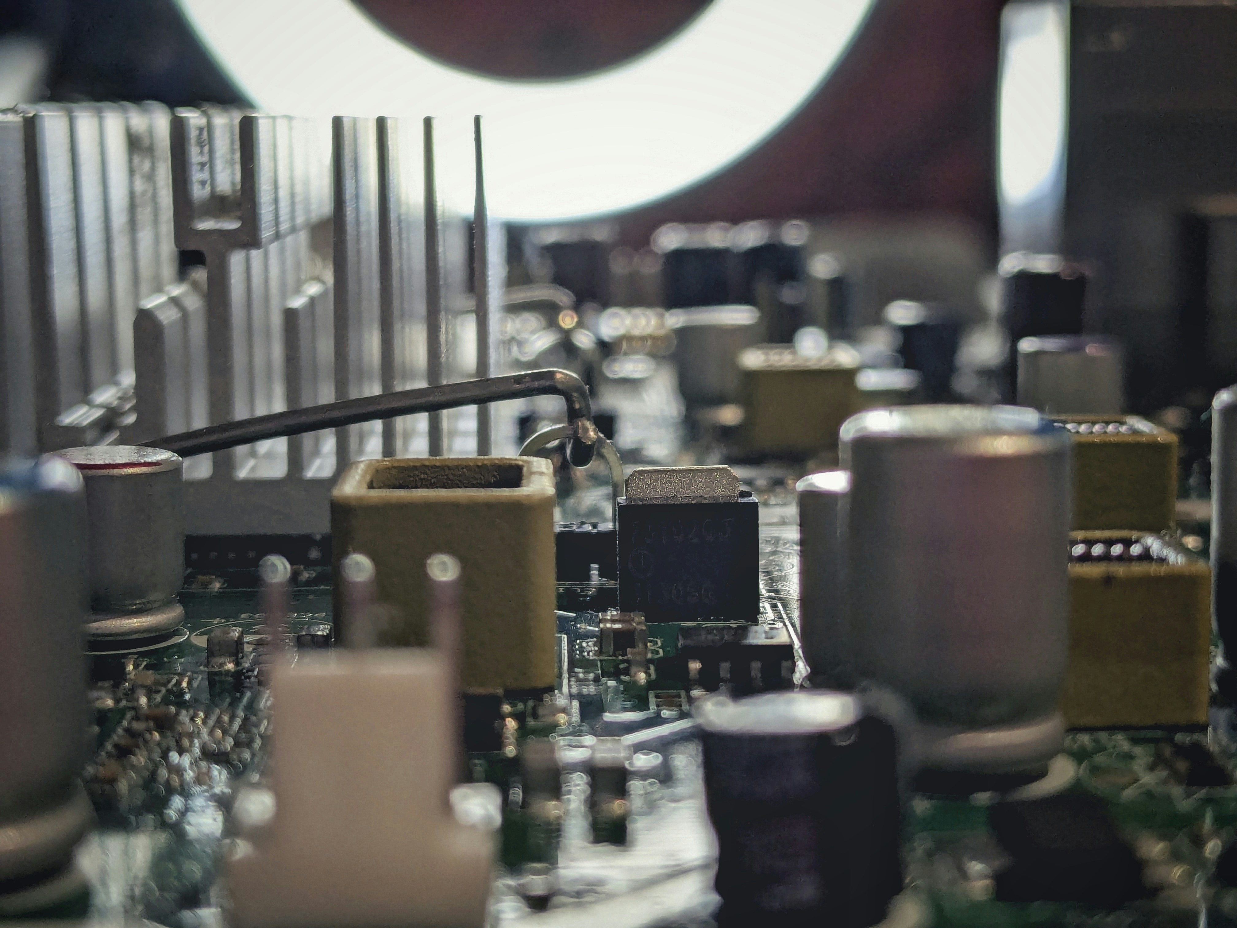 A close up of many electronic components on a table photo – Free ...