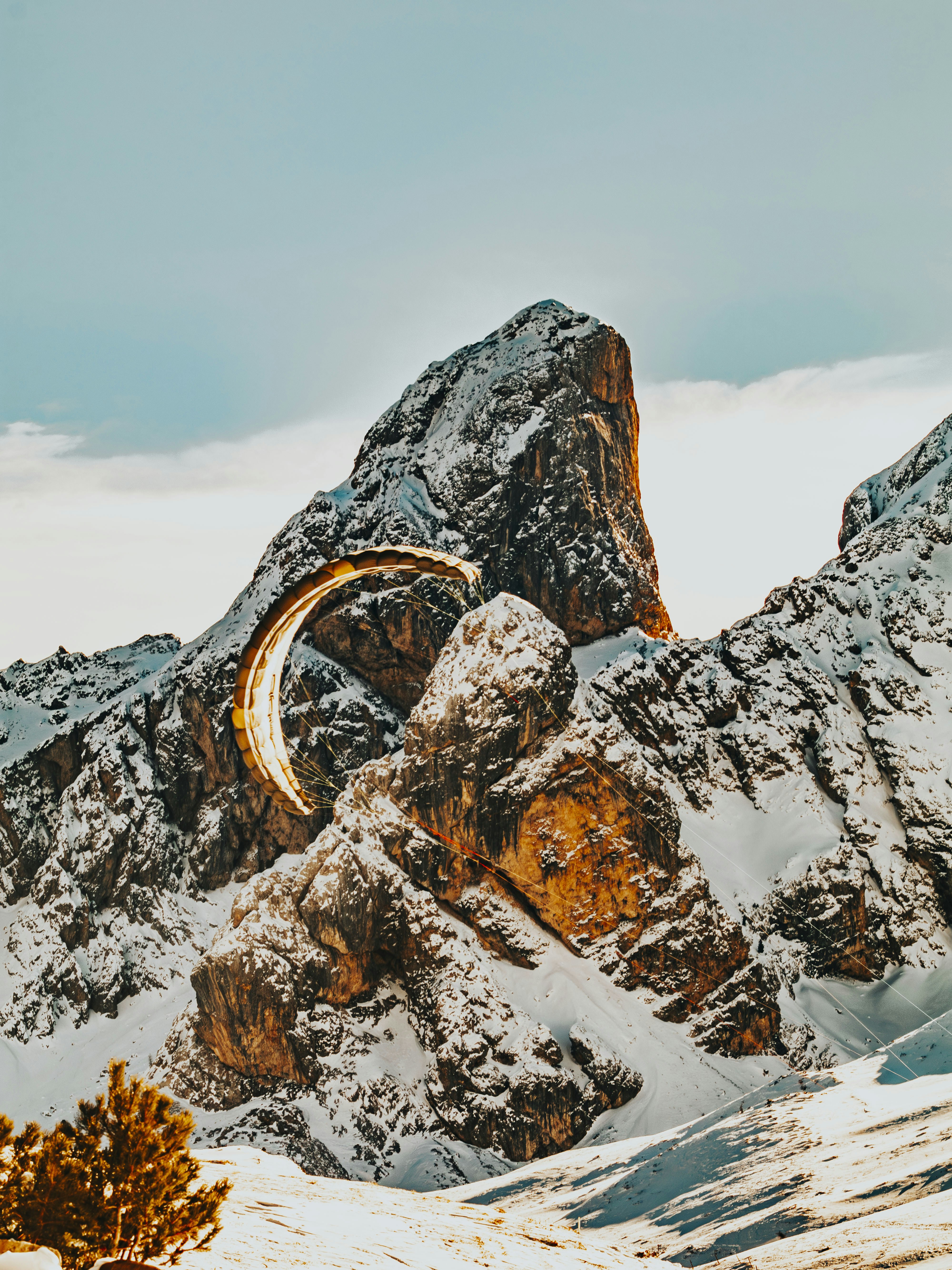Ring of Light: A Snow-Draped Peak Encircling the Sky