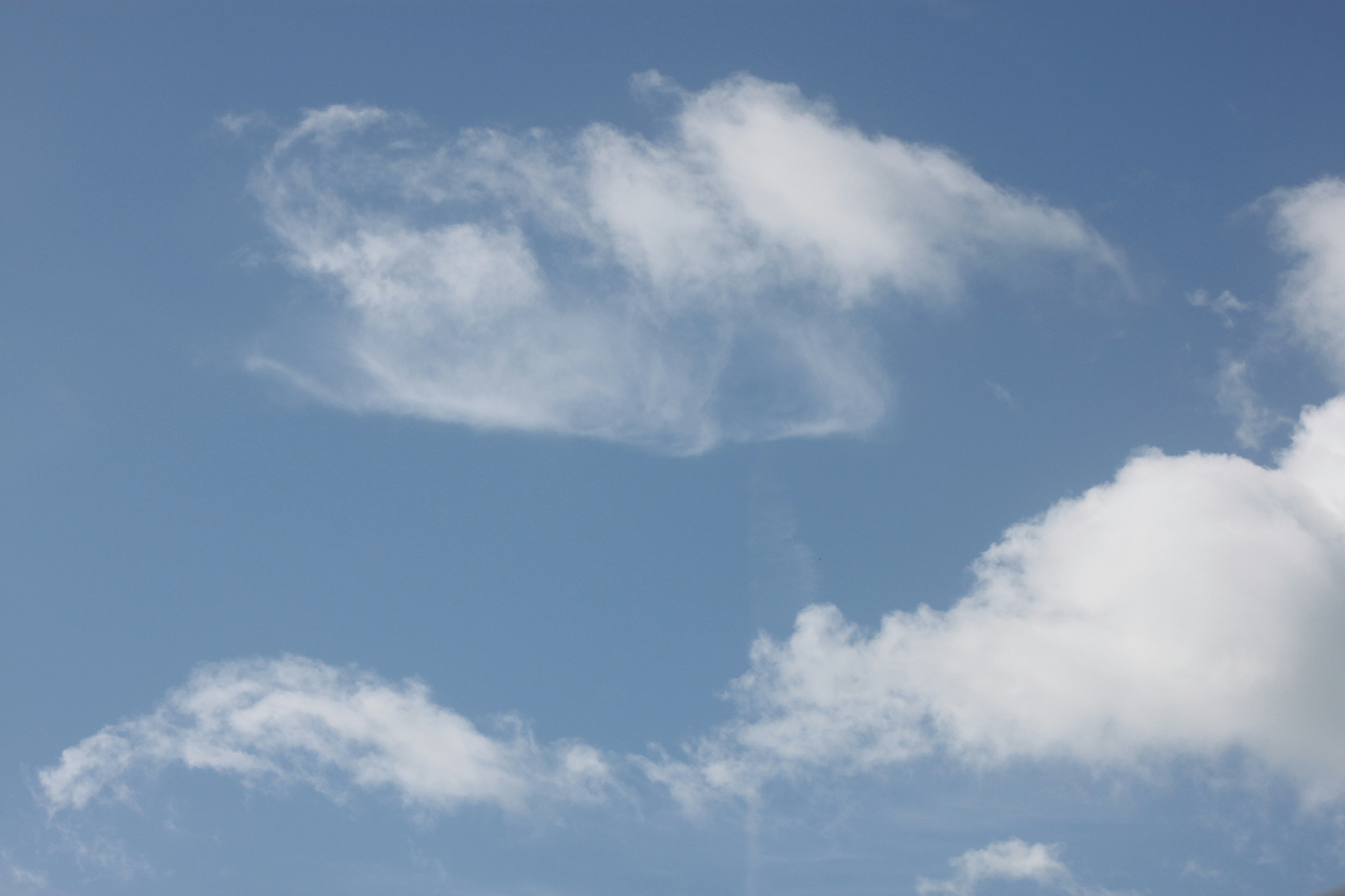 A Quiet Patch of Sky: Cloud Fragments in Blue