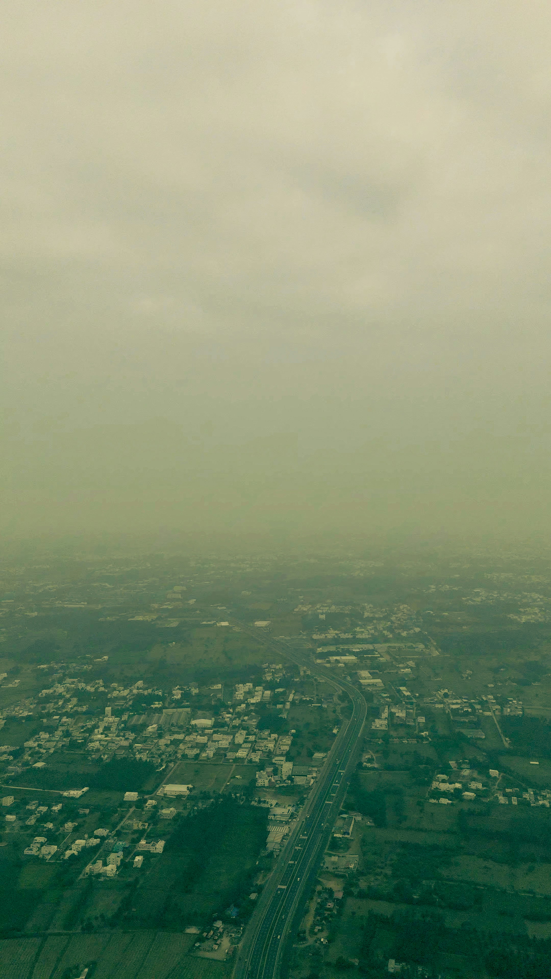 An aerial view of a city and a highway photo – Free Avinashi Image on ...