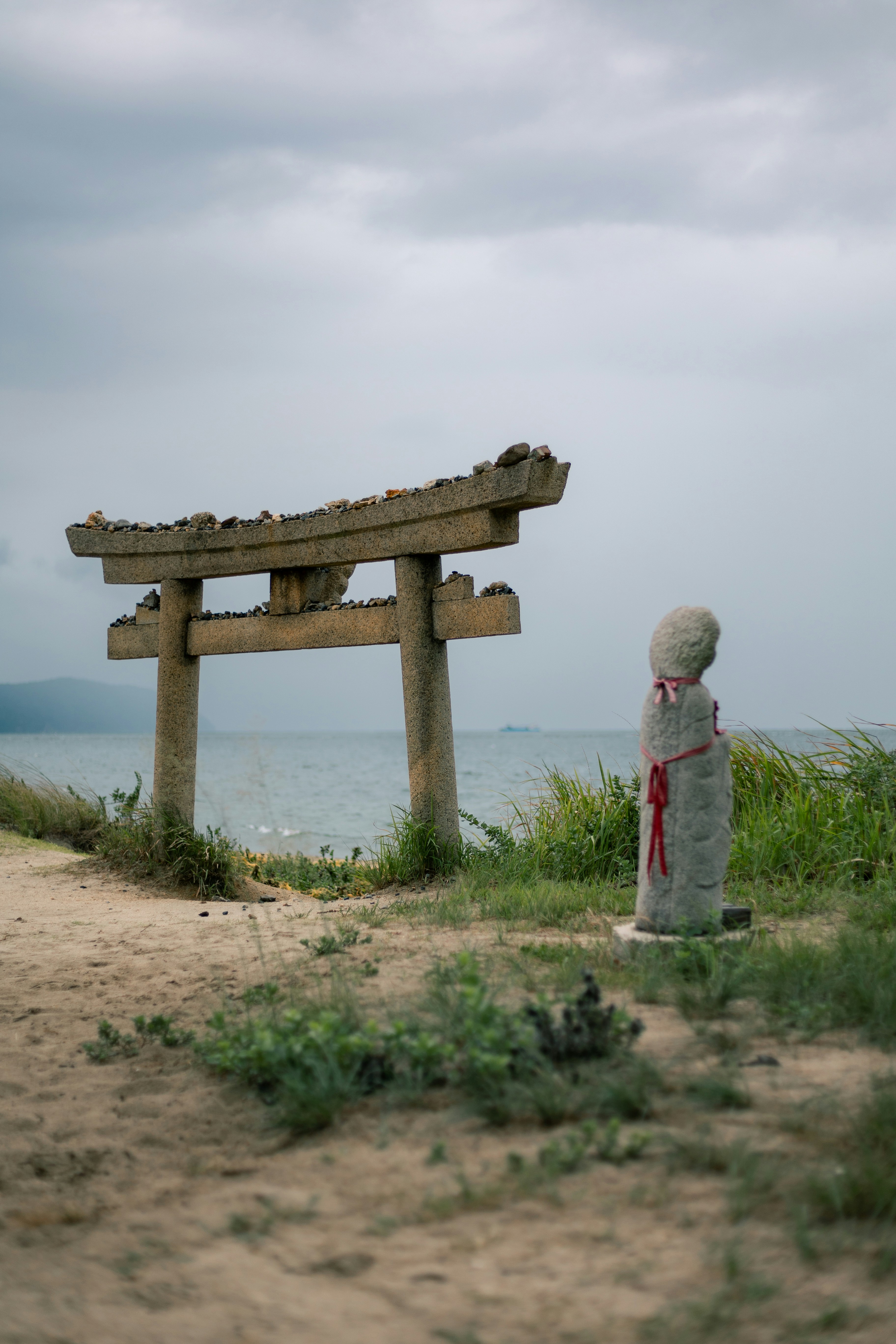 Guardians by the Atlantic: A Weathered Torii and Shrine Statue