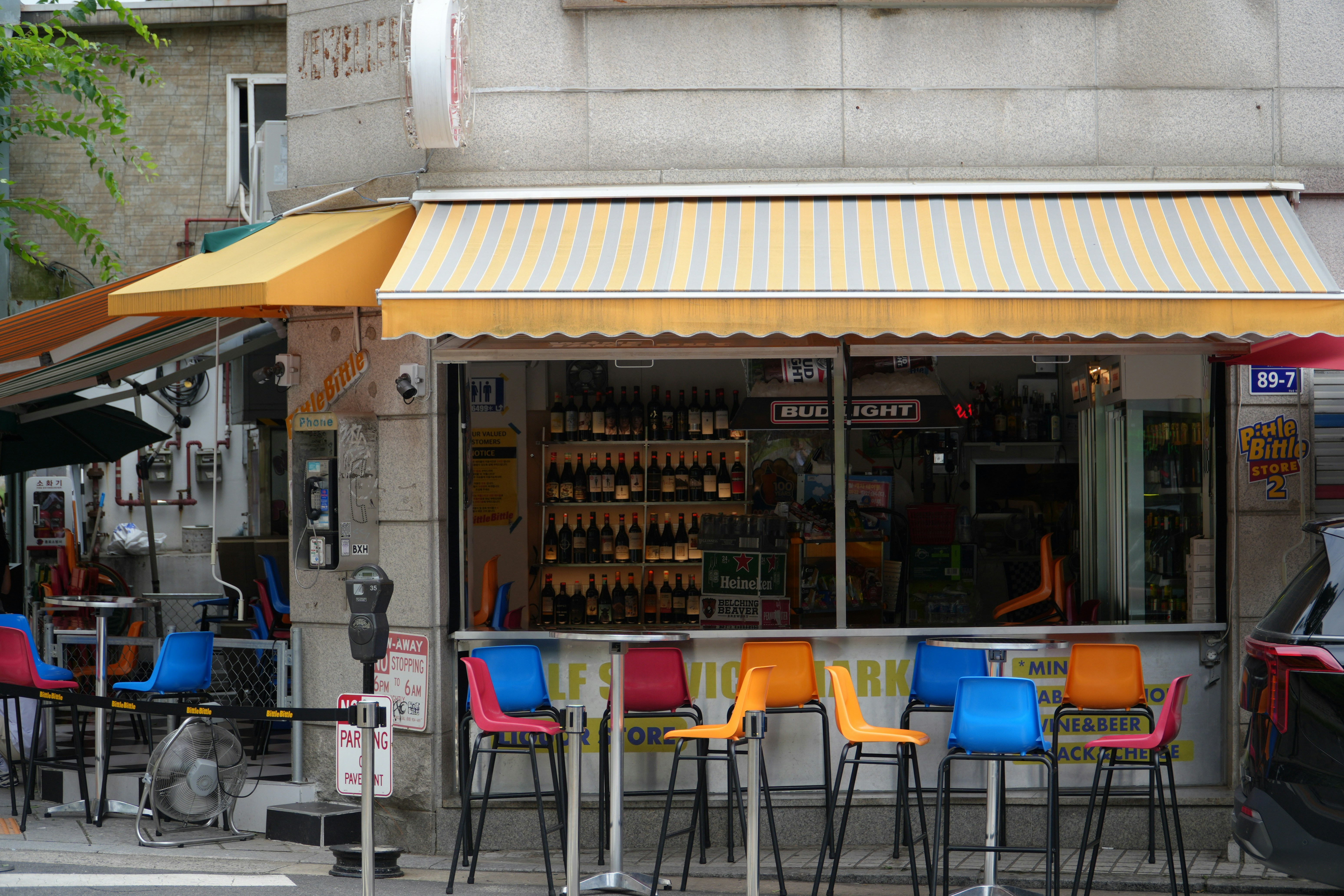 Cafe in Seoul | A group of chairs sitting outside of a restaurant