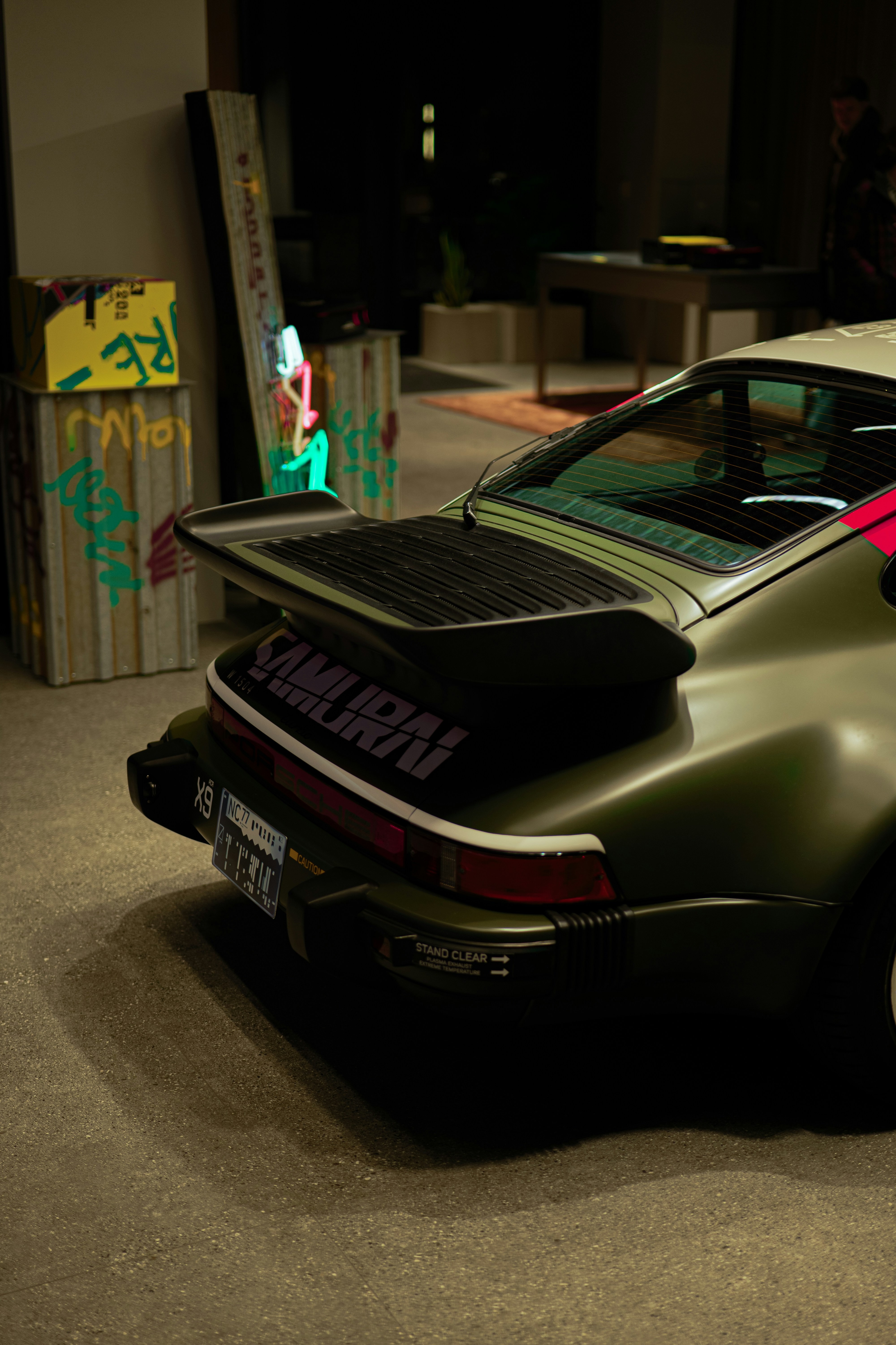 Neon Alley Rear: Matte Olive Classic Under Industrial Glow