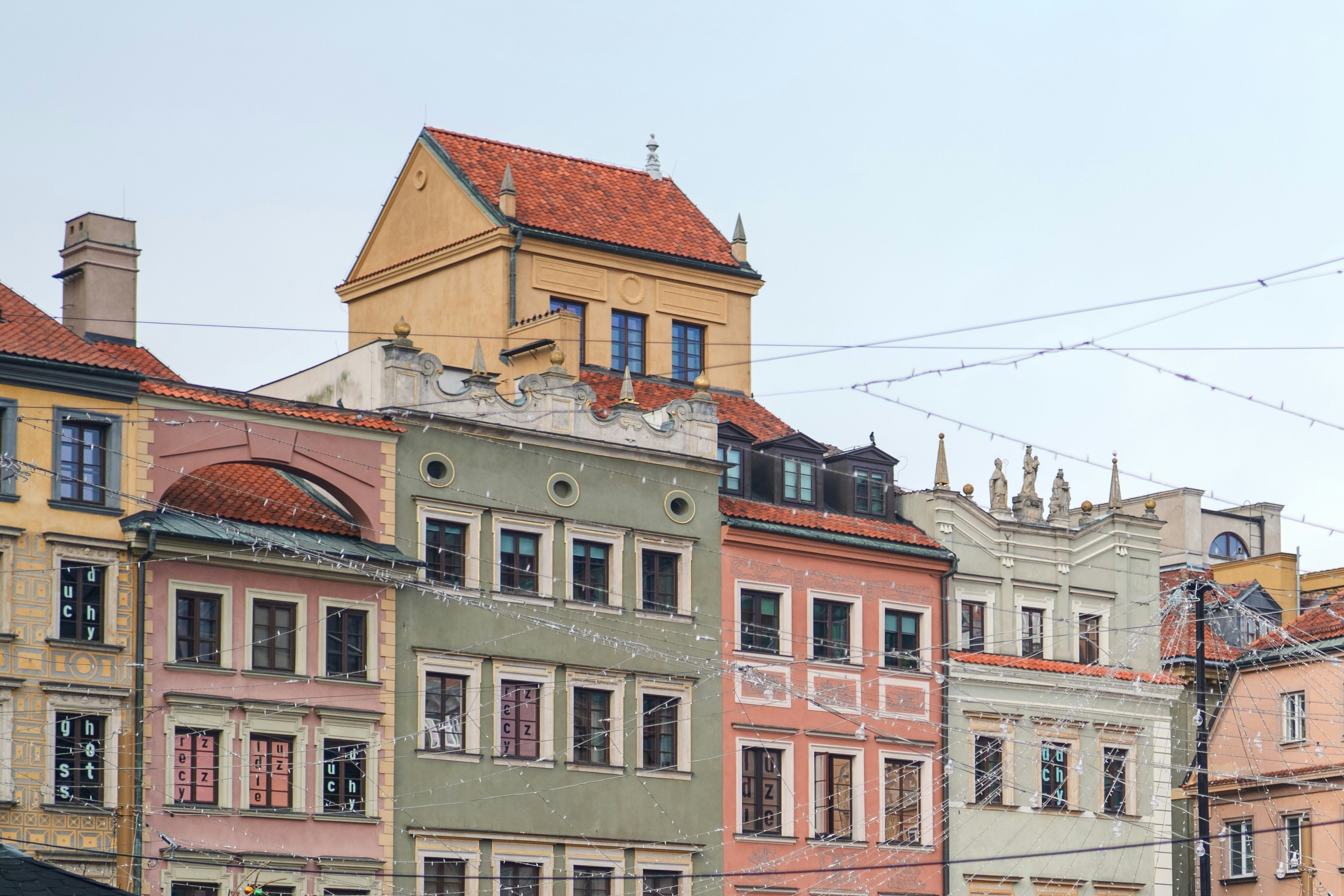 A row of colorful buildings in a city photo – Free Warsaw Image on Unsplash
