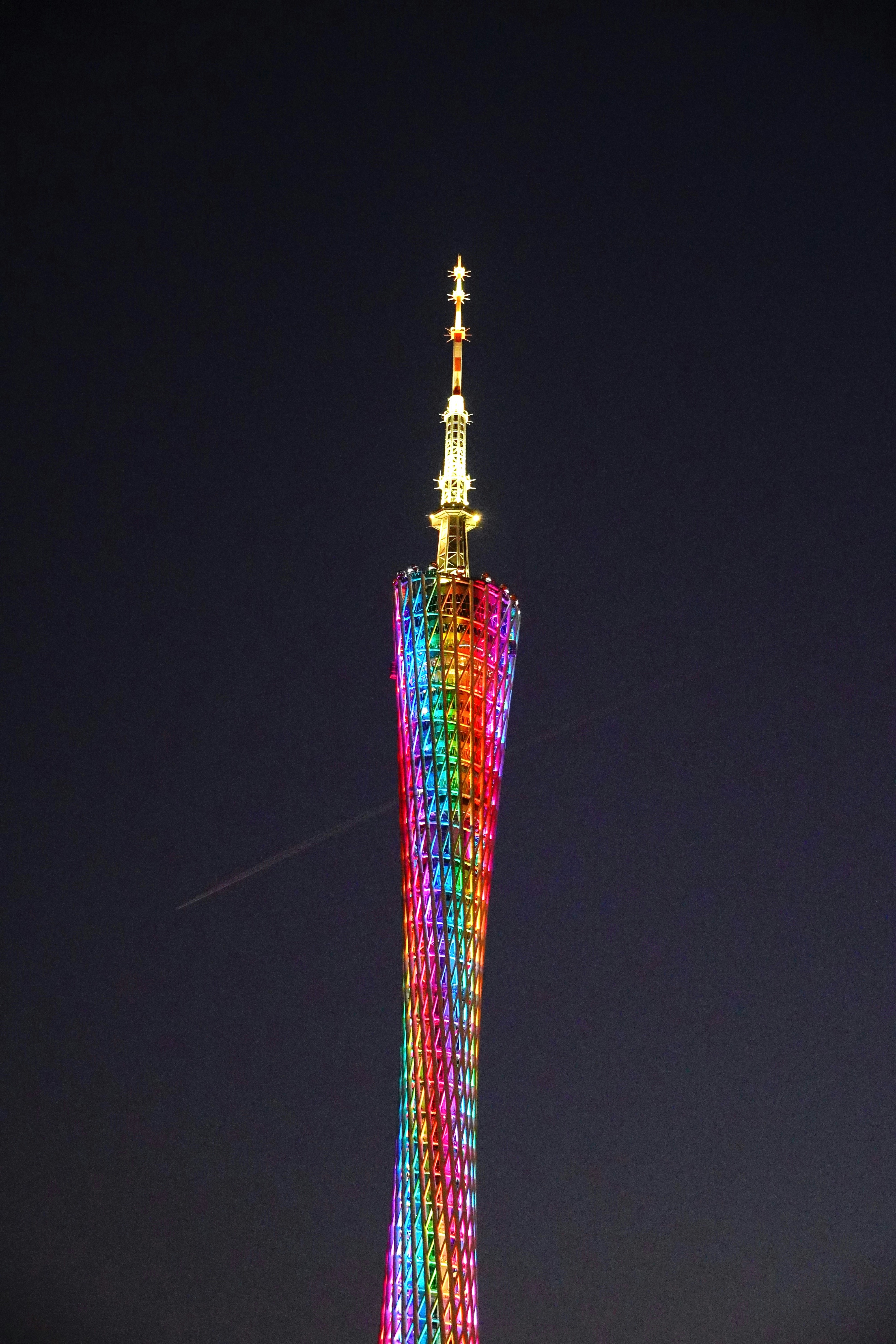 Prismatic Spire: Neon Cascade Over a Night Tower