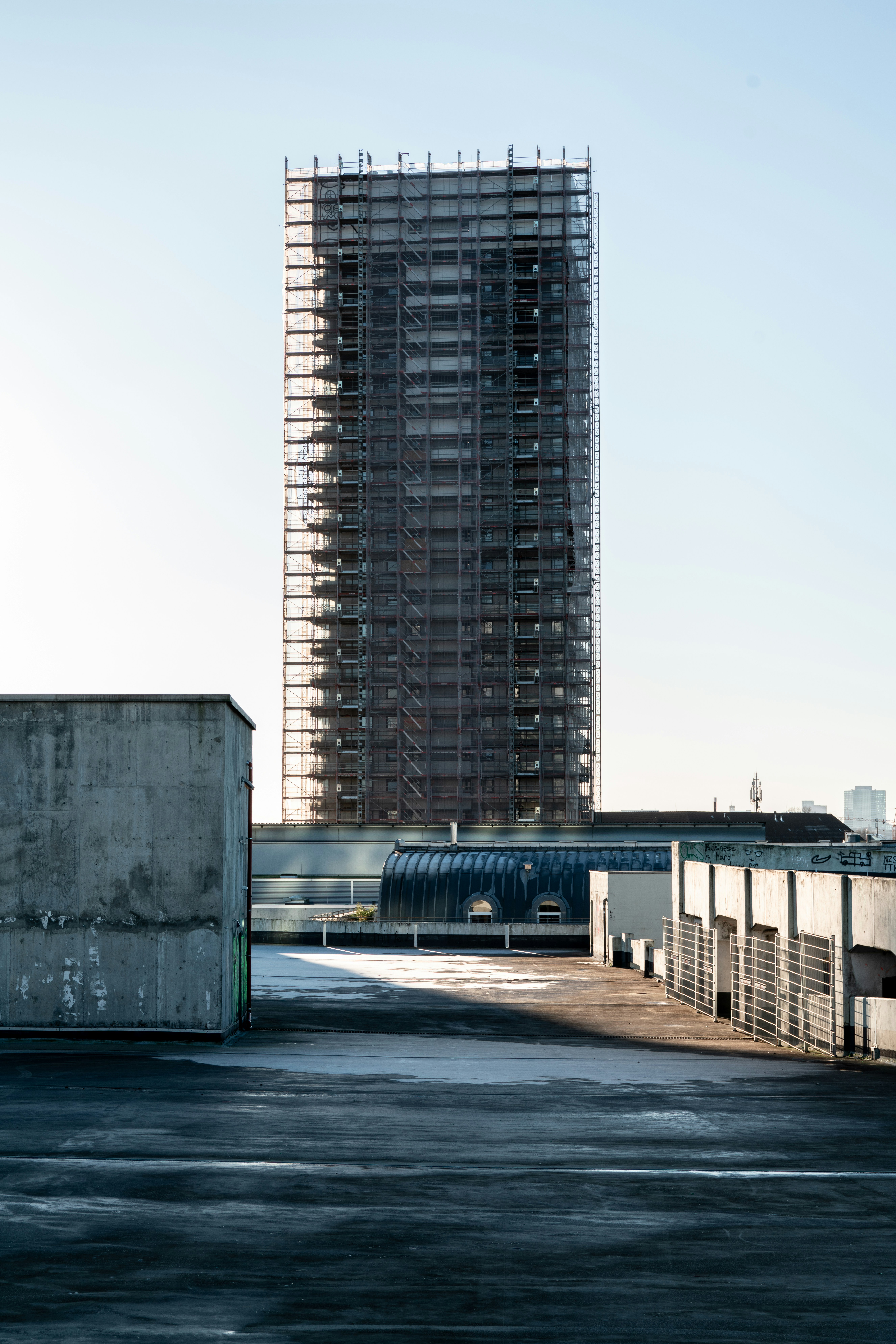 Skeleton of Steel: Tower Rising from a Rooftop