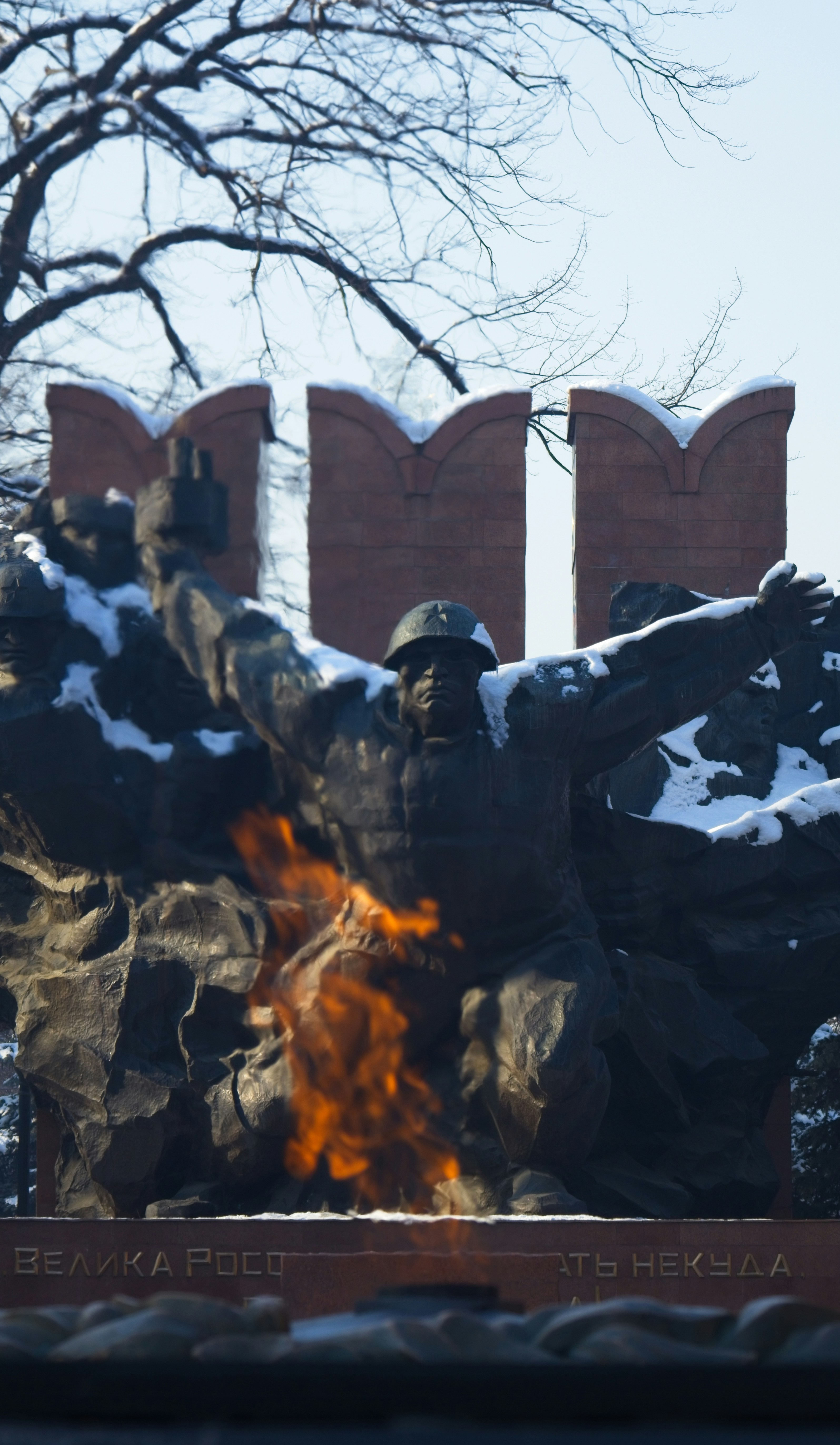 A statue of a man with a fire in his hand