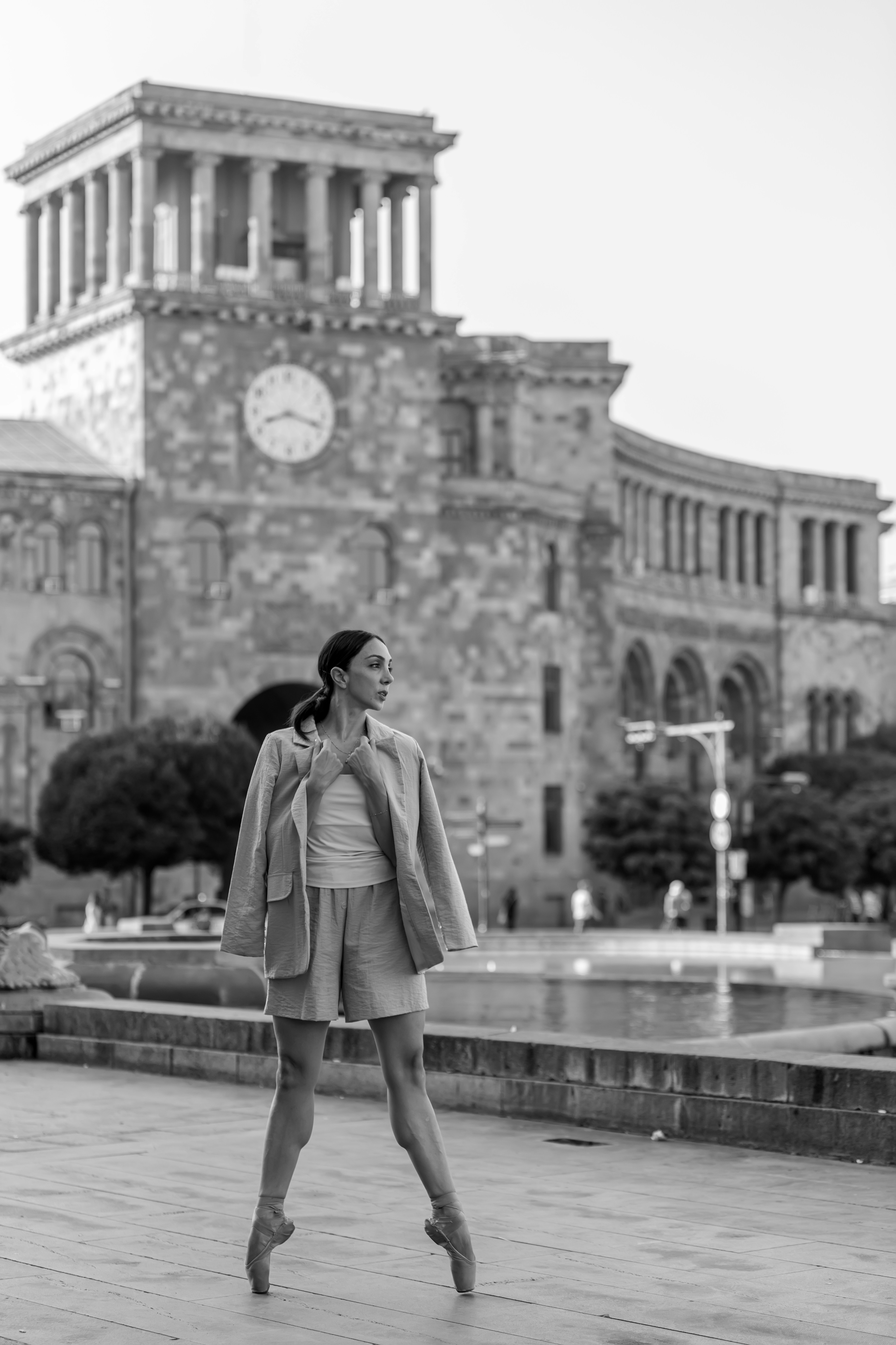 Pointe Under the Clock: Ballet in Front of a Historic Arcaded Building