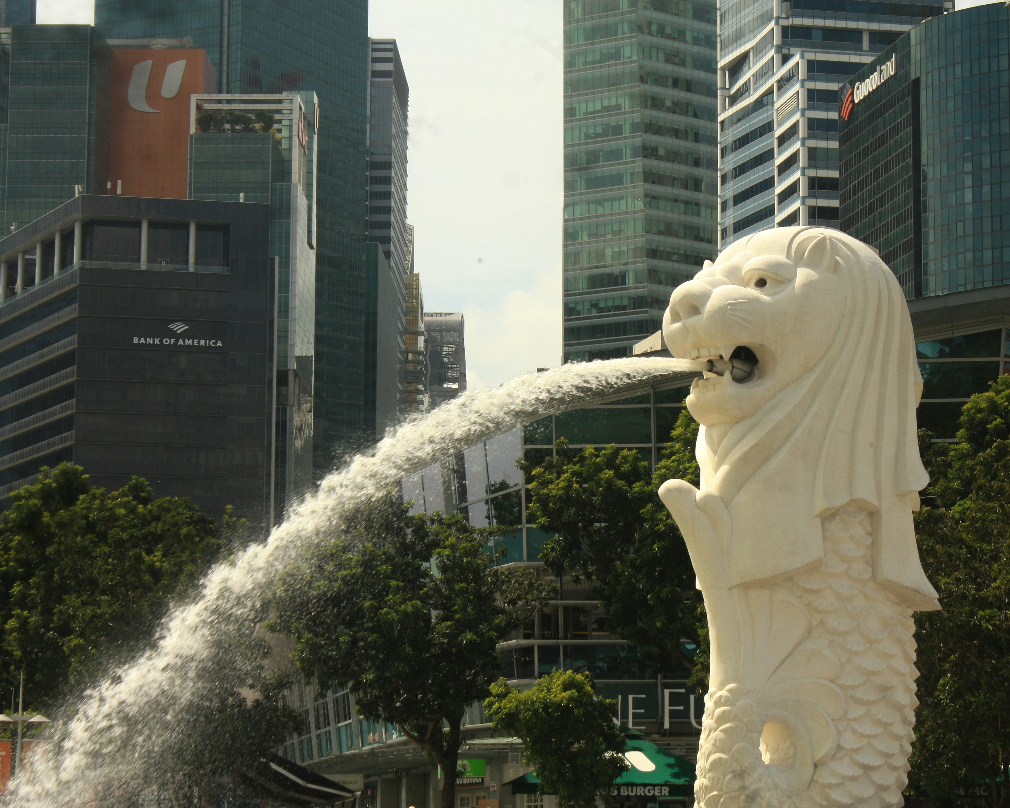 Merlion Spews a Water Arc Across Singapore's Glass Skyline