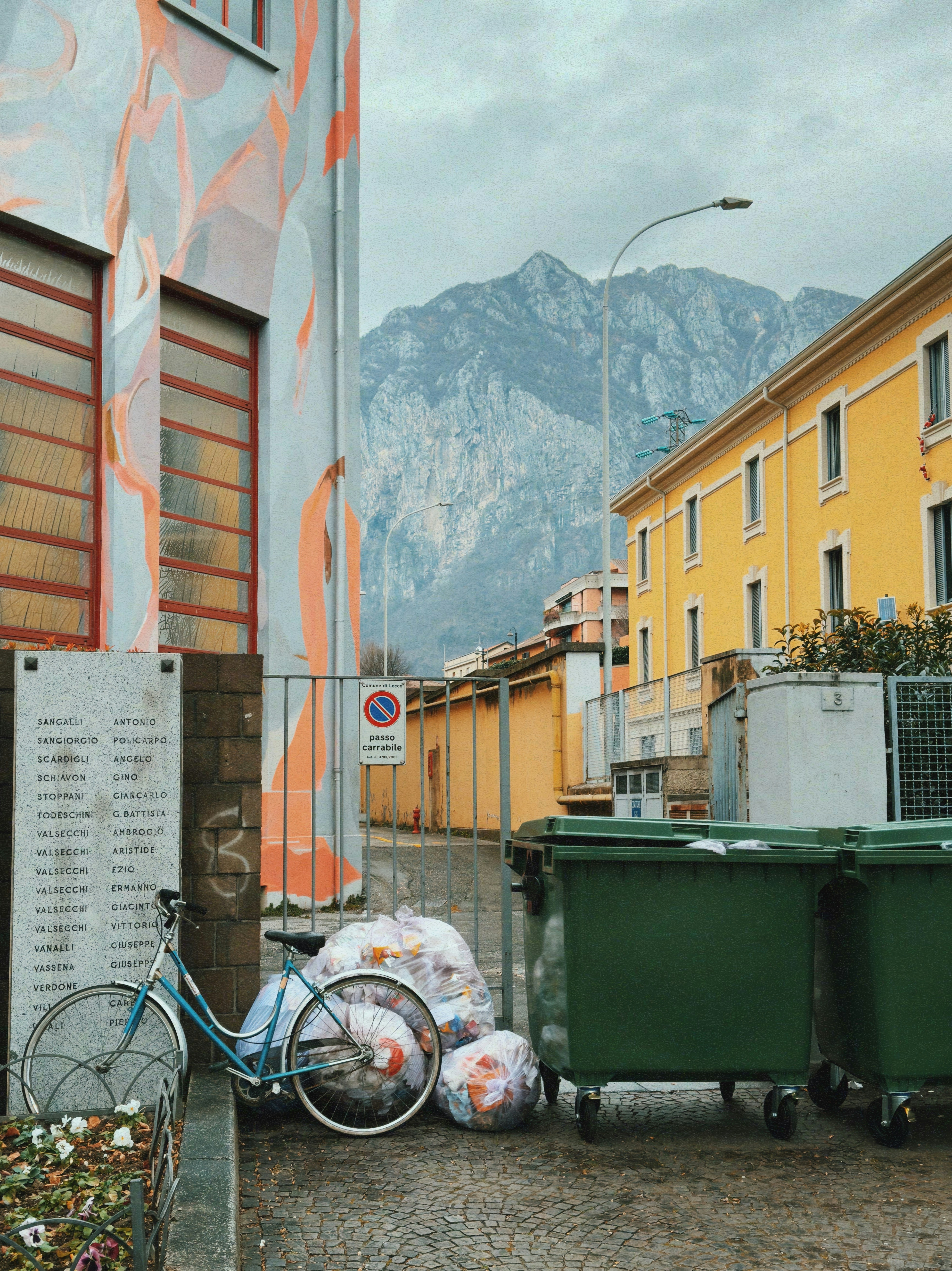 Urban Alley Calm Between Colorful Walls and Mountain Backdrop