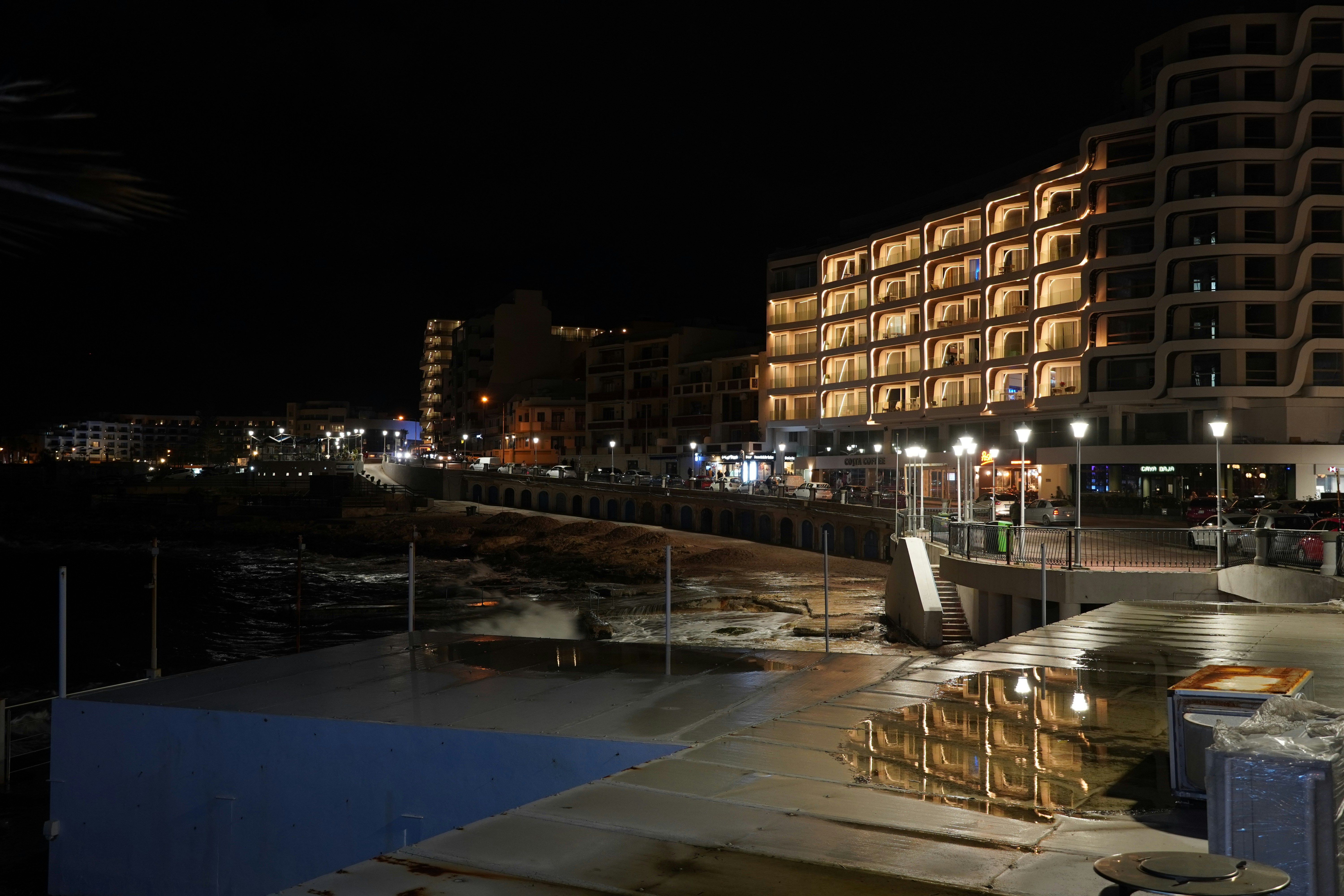 Nighttime Promenade: Golden Balconies Reflect on the Quiet Harbor