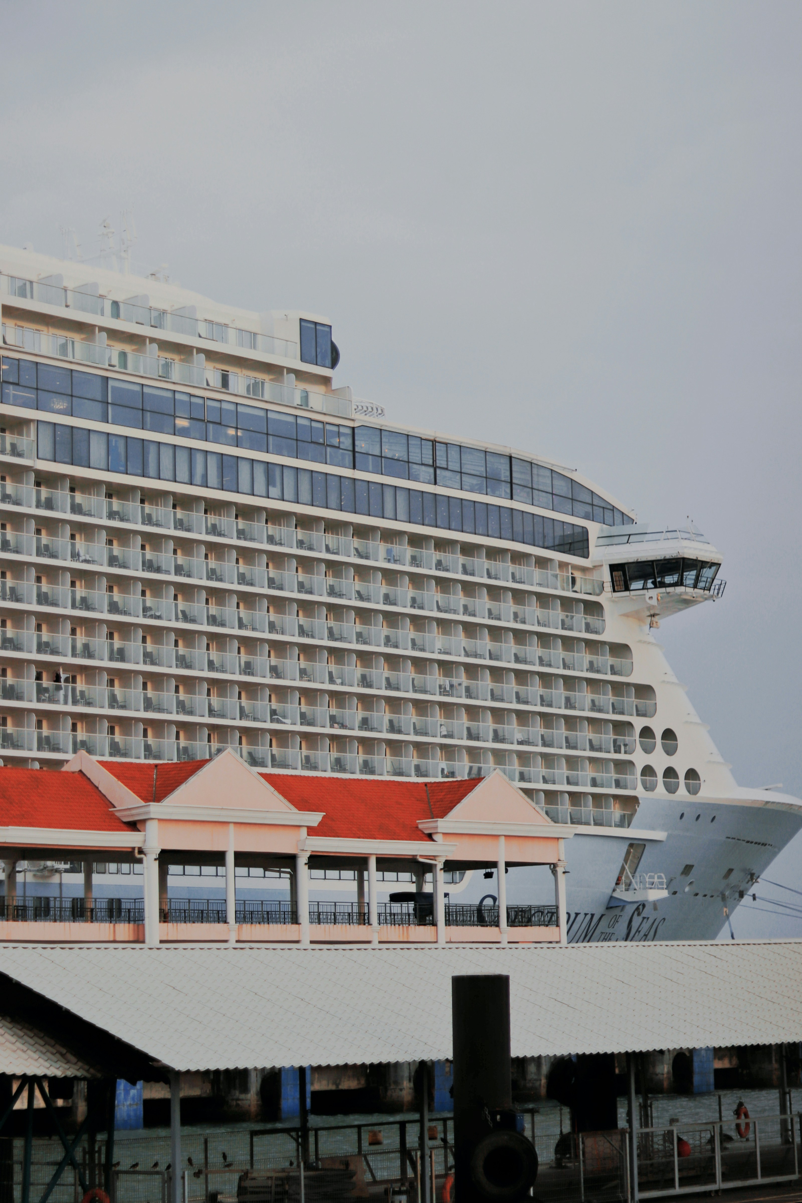 A large cruise ship docked at a pier