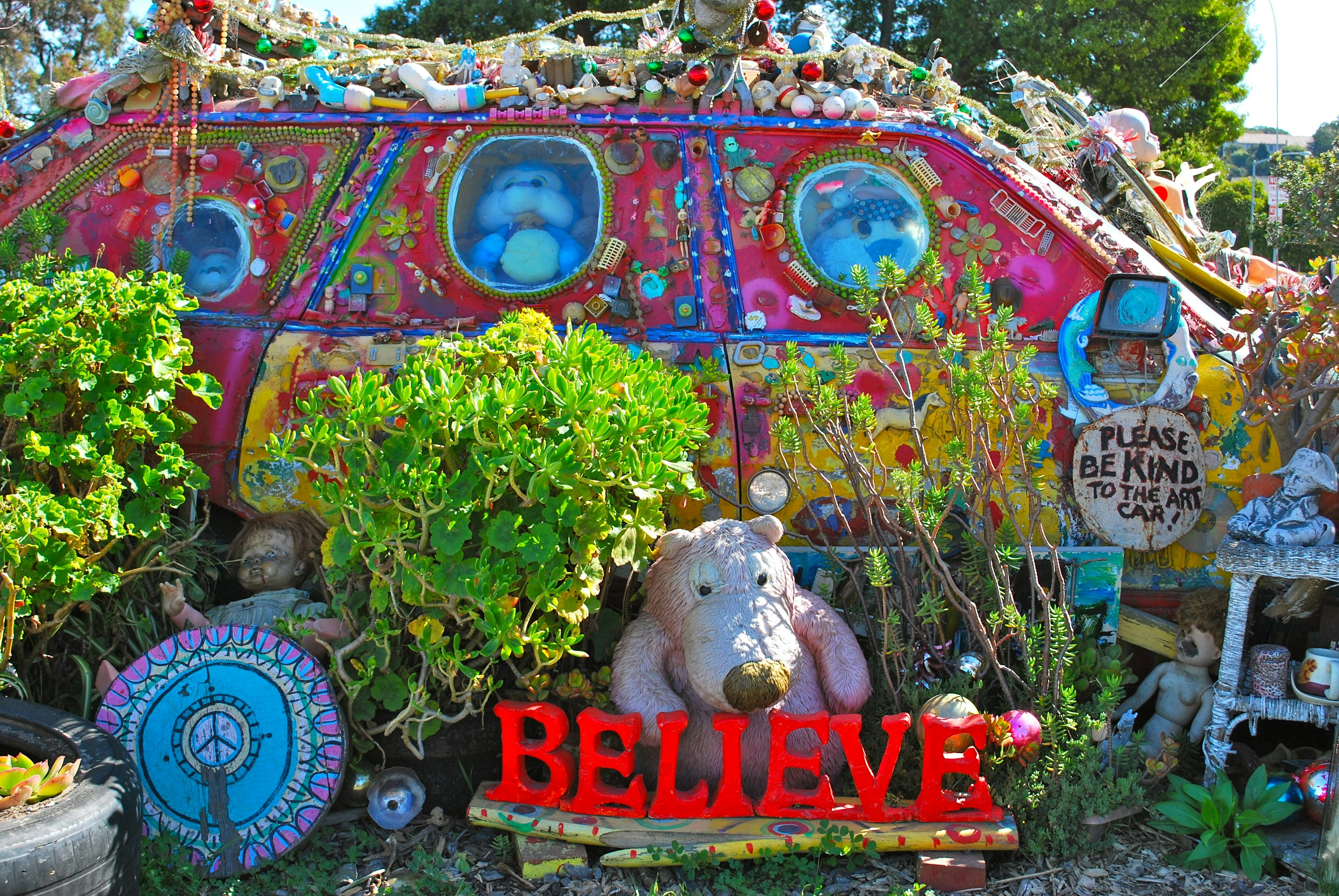 Believe sculpture and whimsical caravan of color