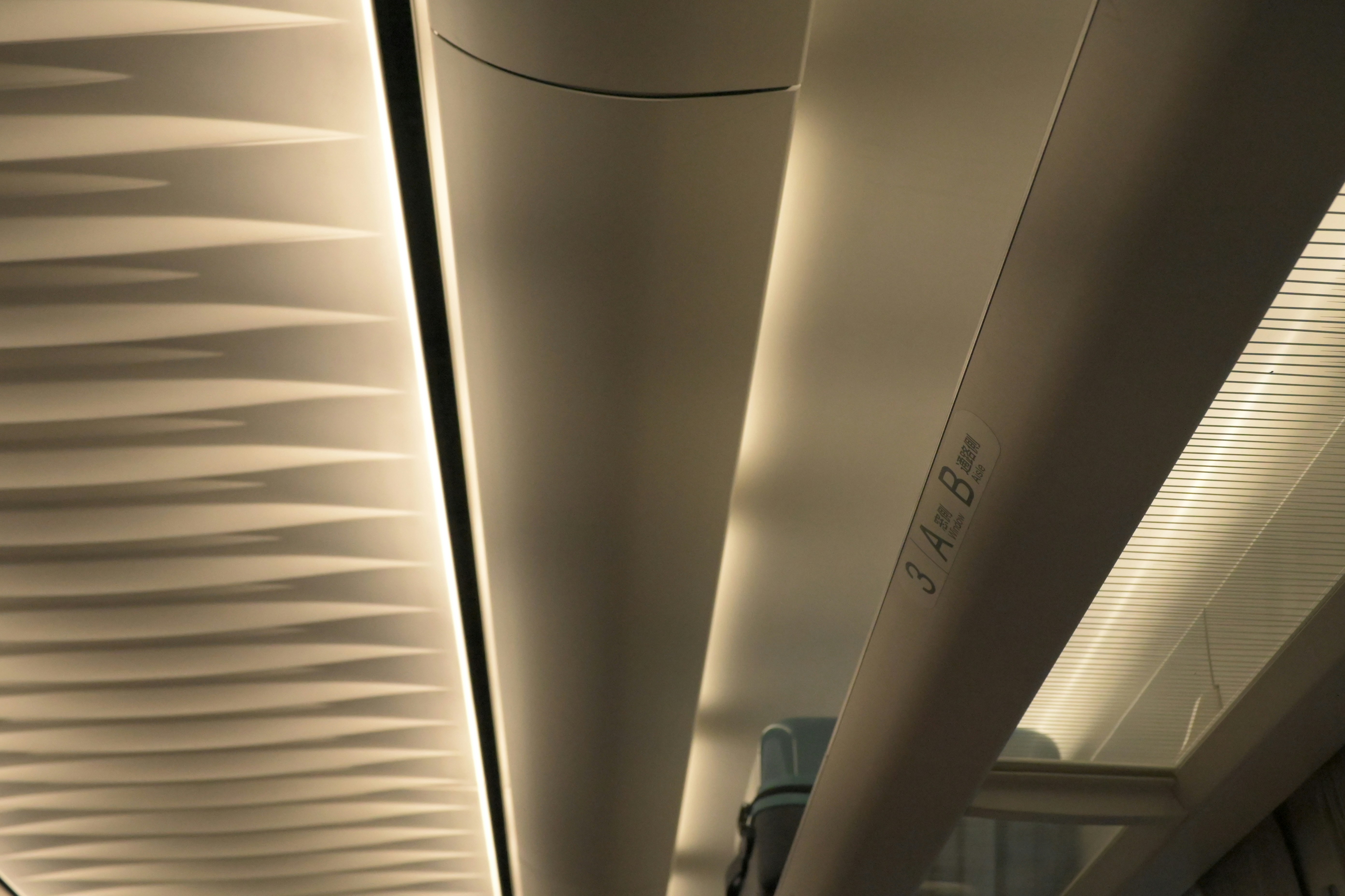 Ribbed Ceiling Corridor: Light Strips and Steel Lines