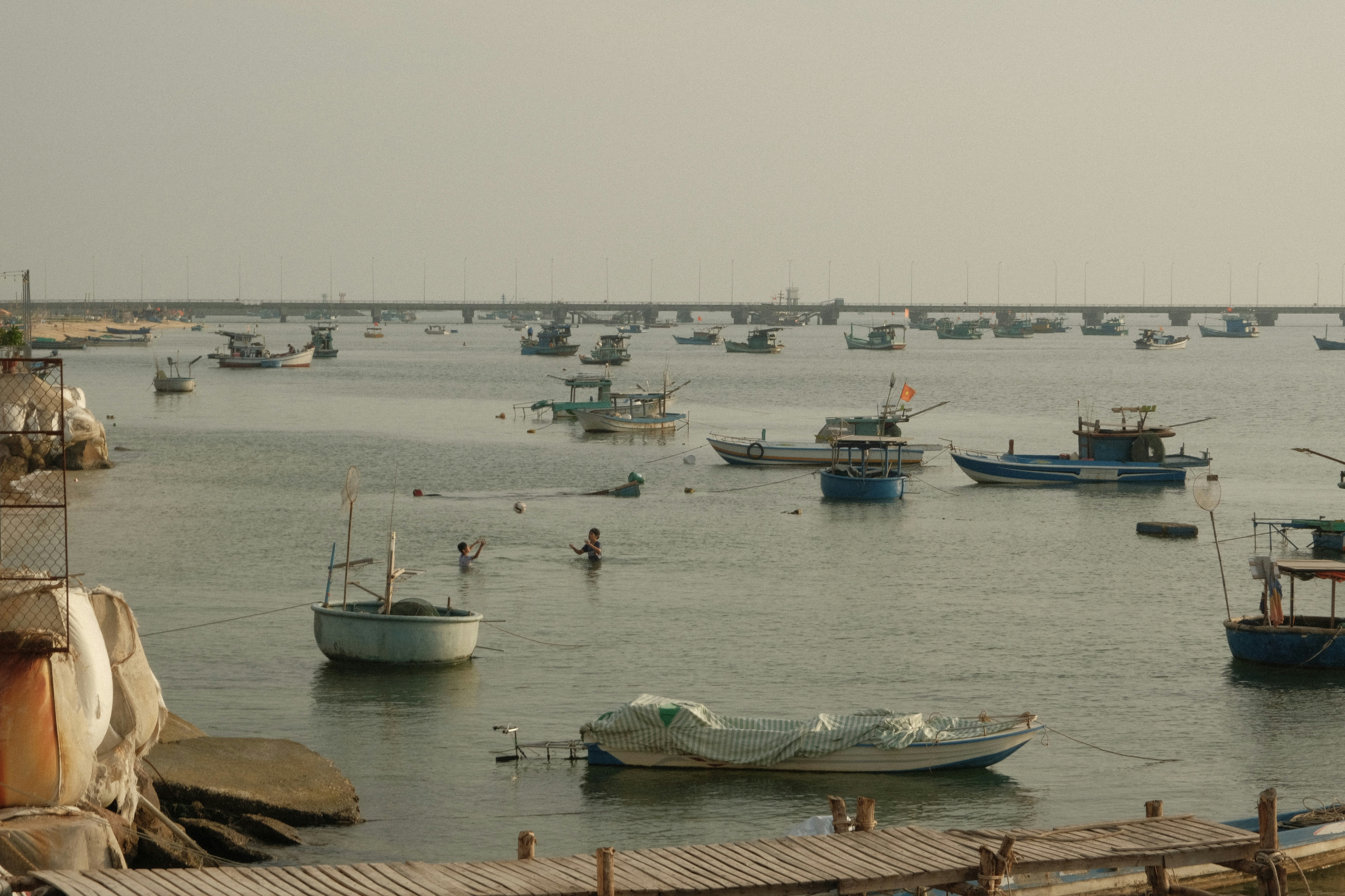 A large body of water filled with lots of boats photo – Free Human ...