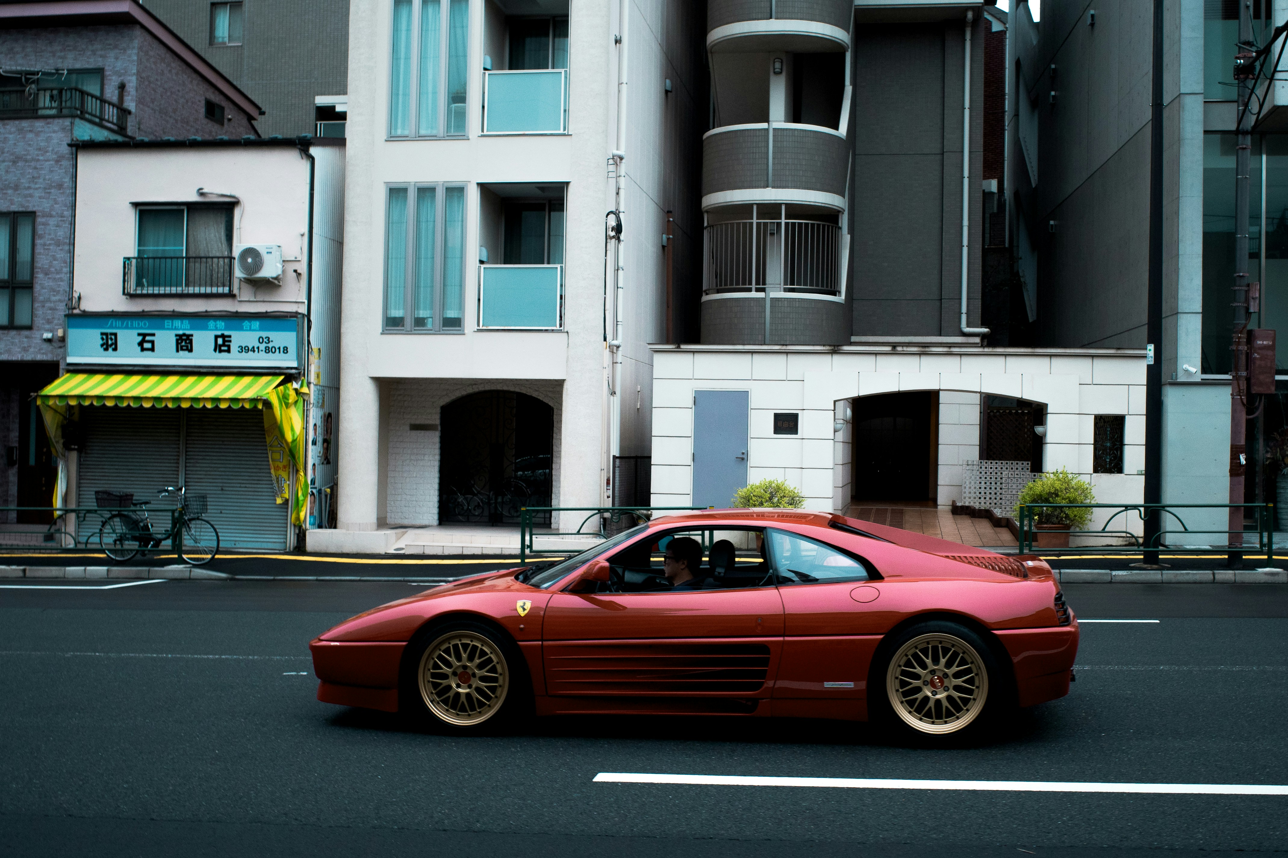 Red Ferrari on a Quiet Tokyo Street: Precision in Motion
