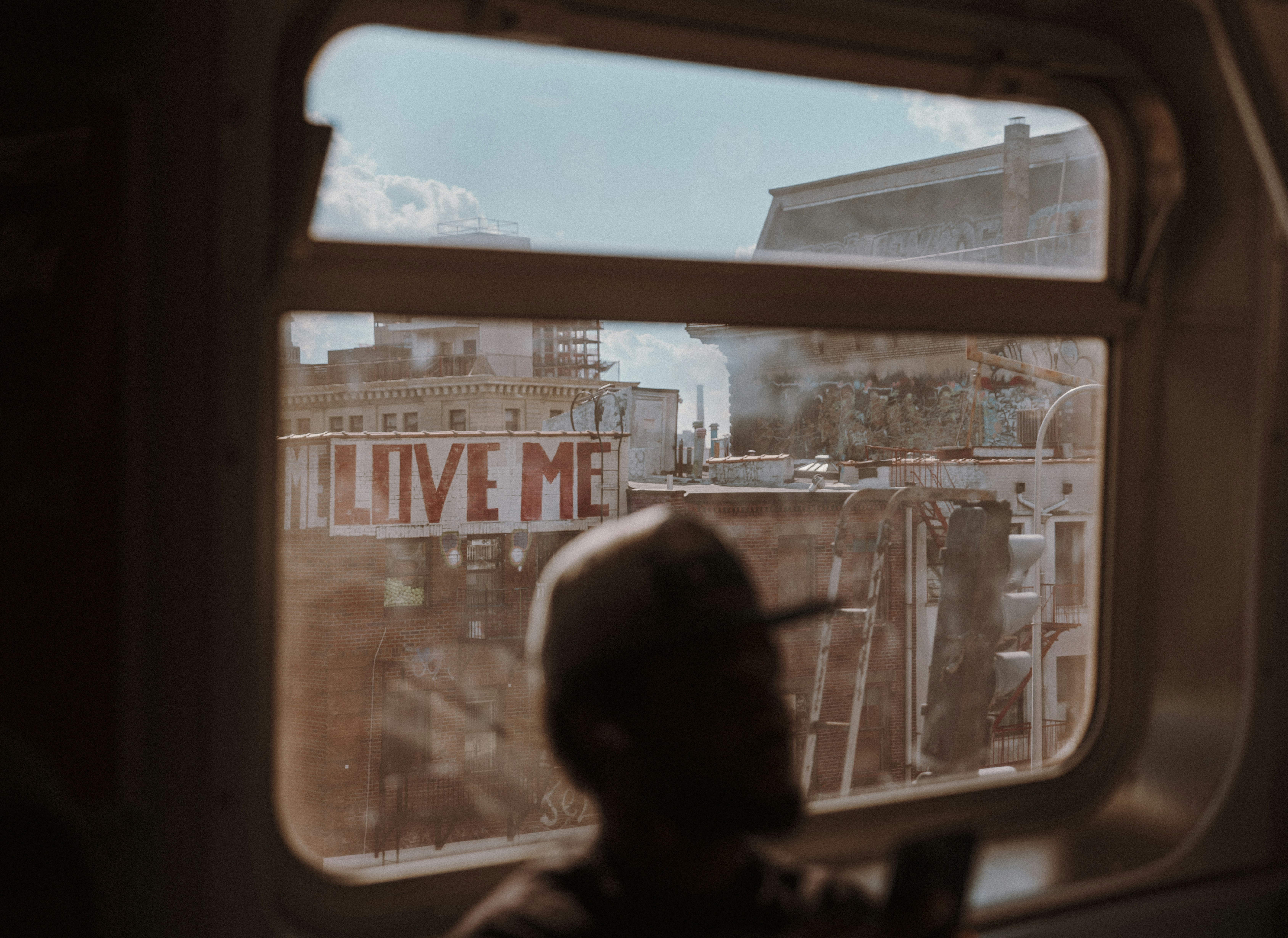 Live Me, Framed: A City Moment Through a Bus Window