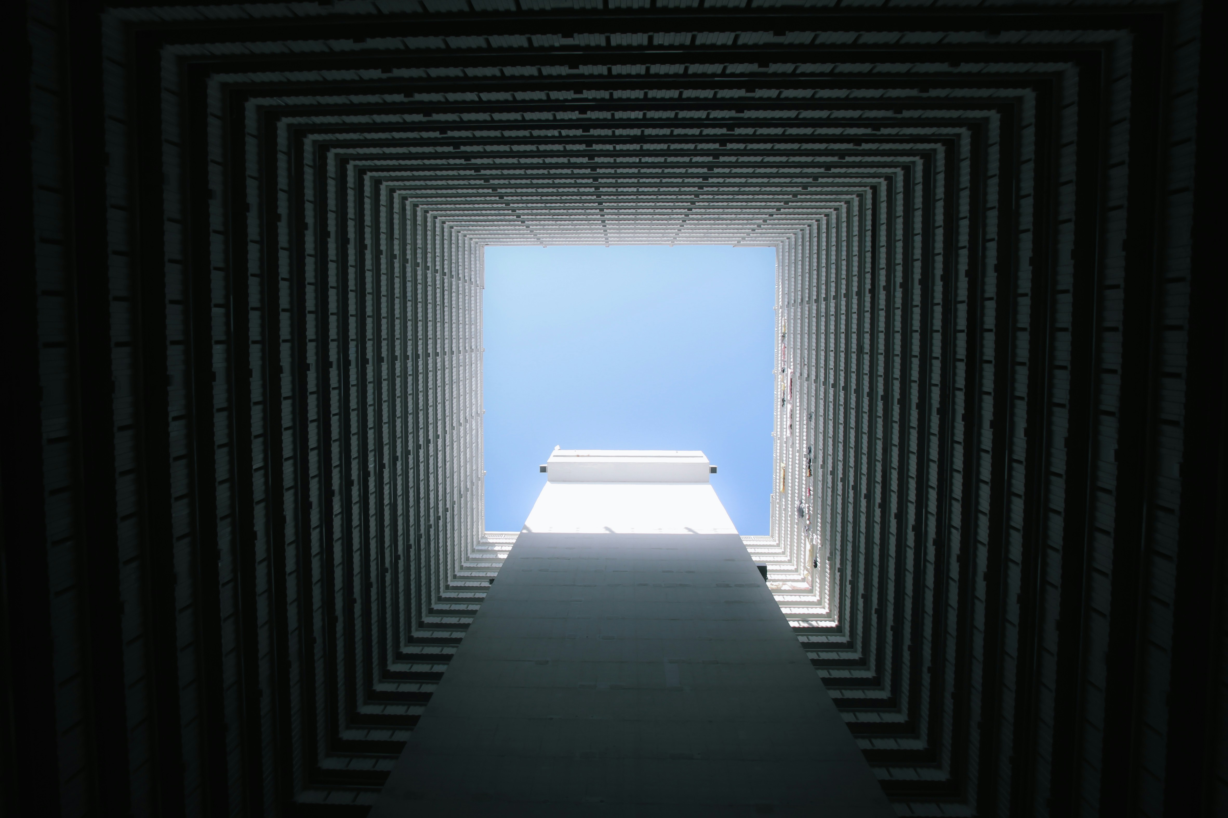 A very tall building with a sky in the background photo – Free City ...