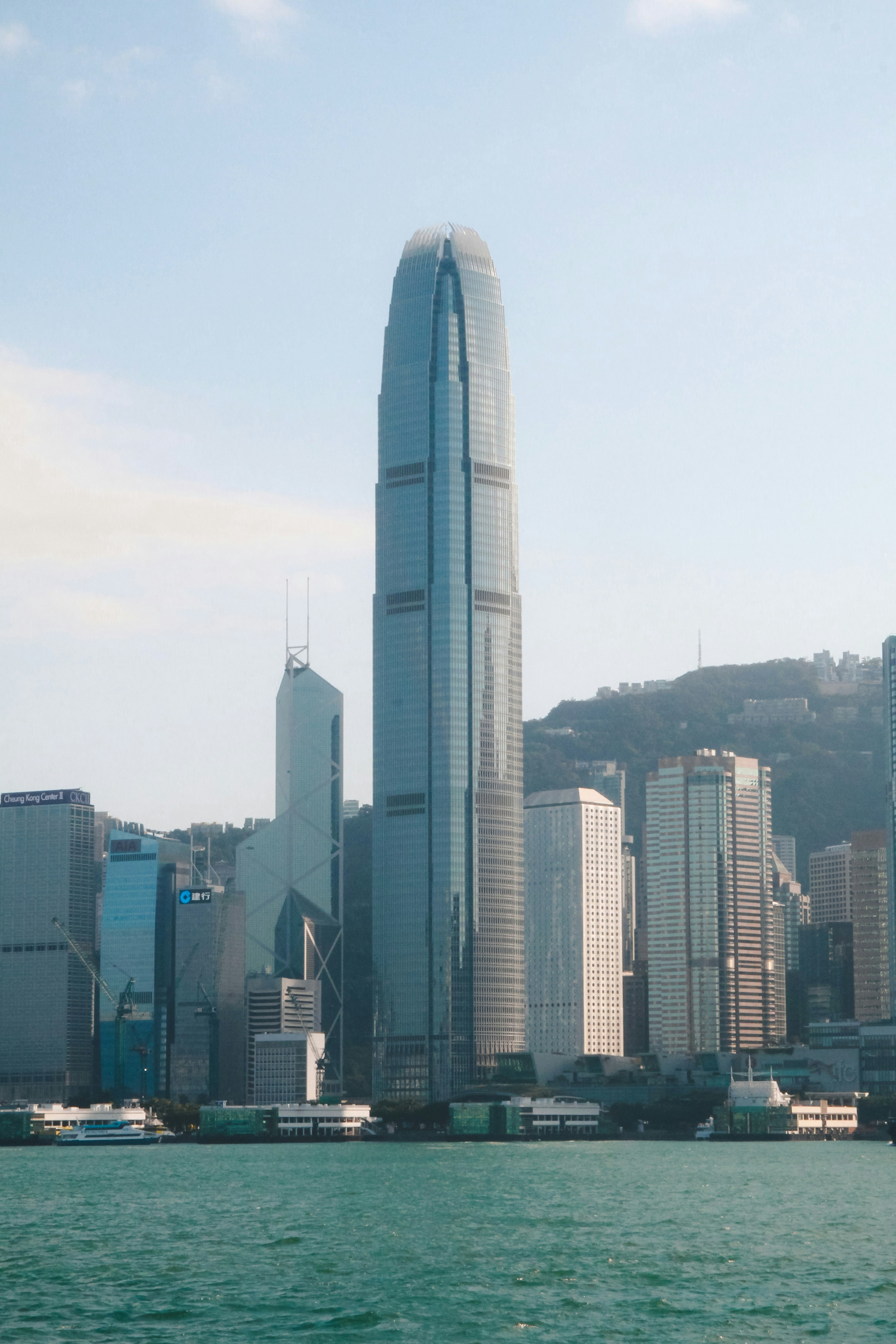 A large body of water with a city in the background photo – Free City ...