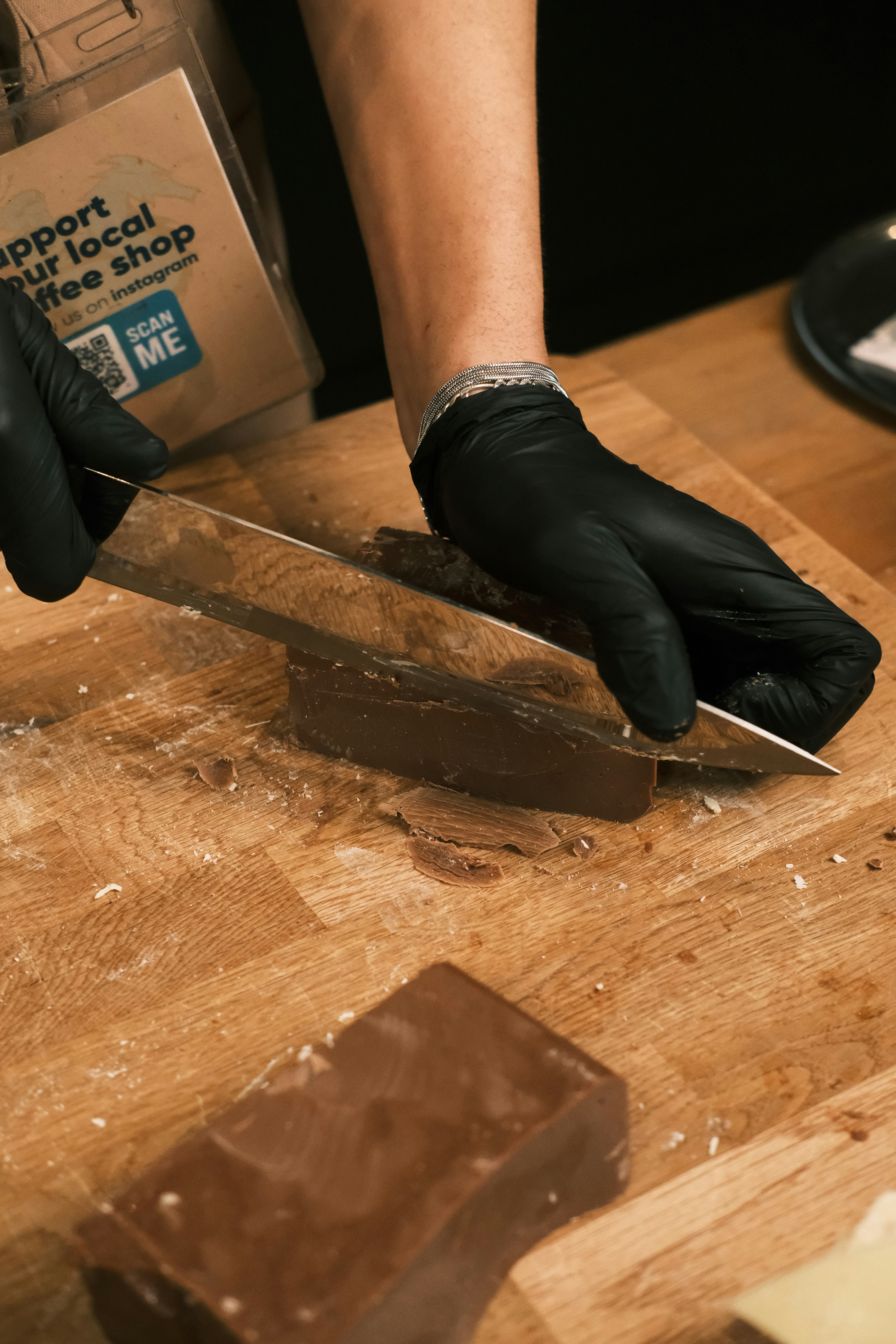 Edgework: precision slicing chocolate on a wooden board