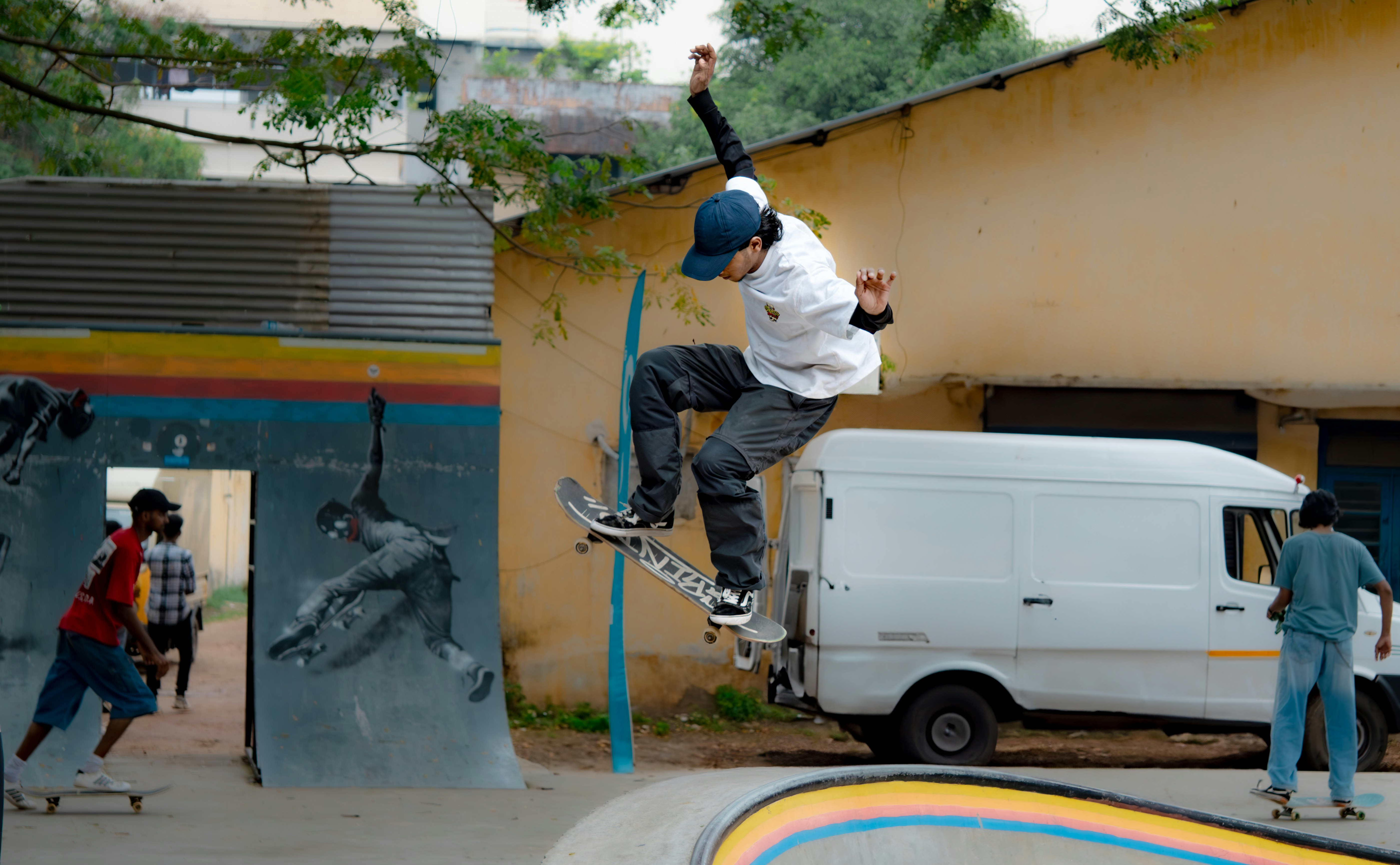 A man riding a skateboard up the side of a ramp photo – Free Loop ...
